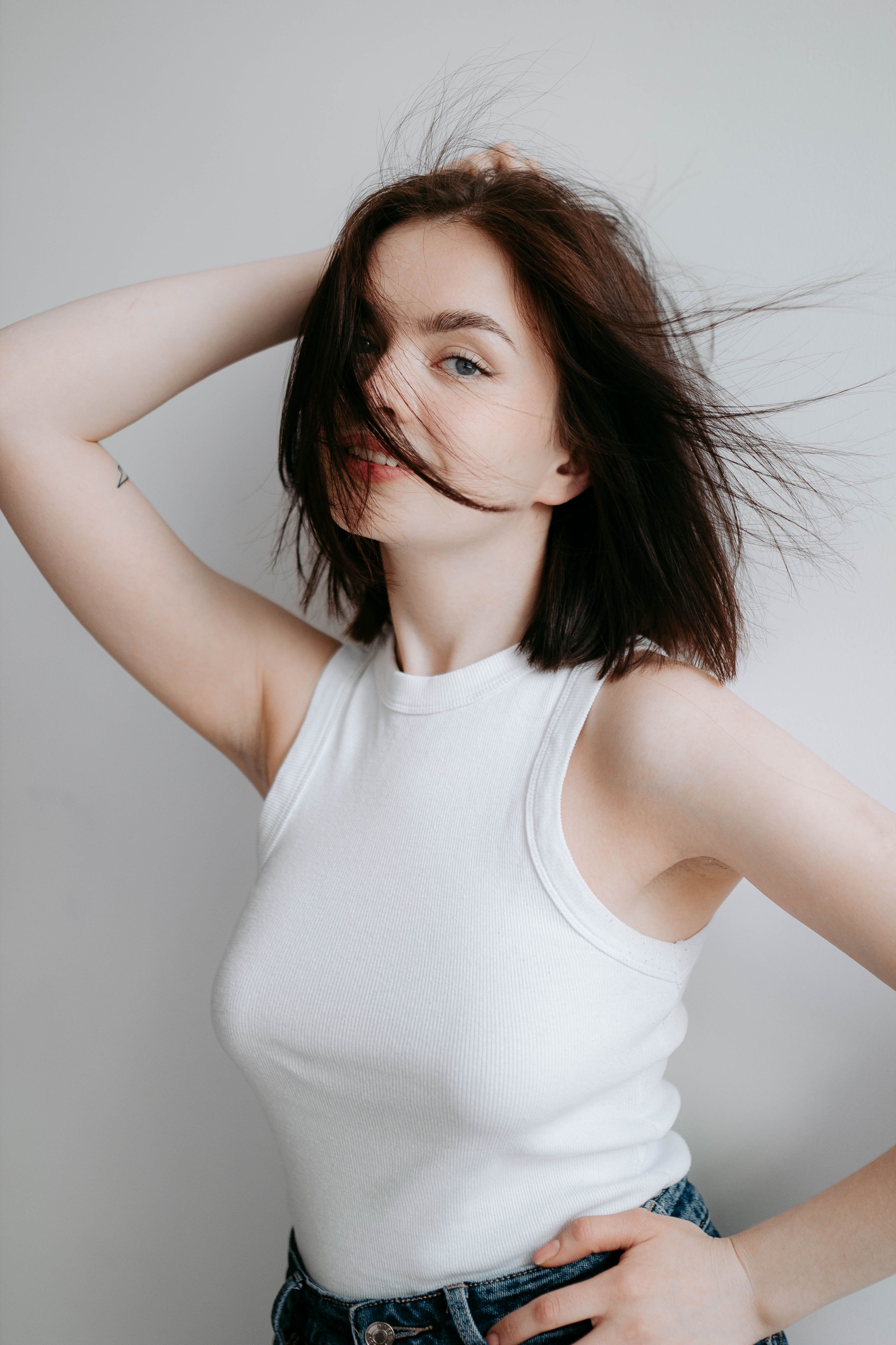 Beautiful Woman in White Tank Top · Free Stock Photo