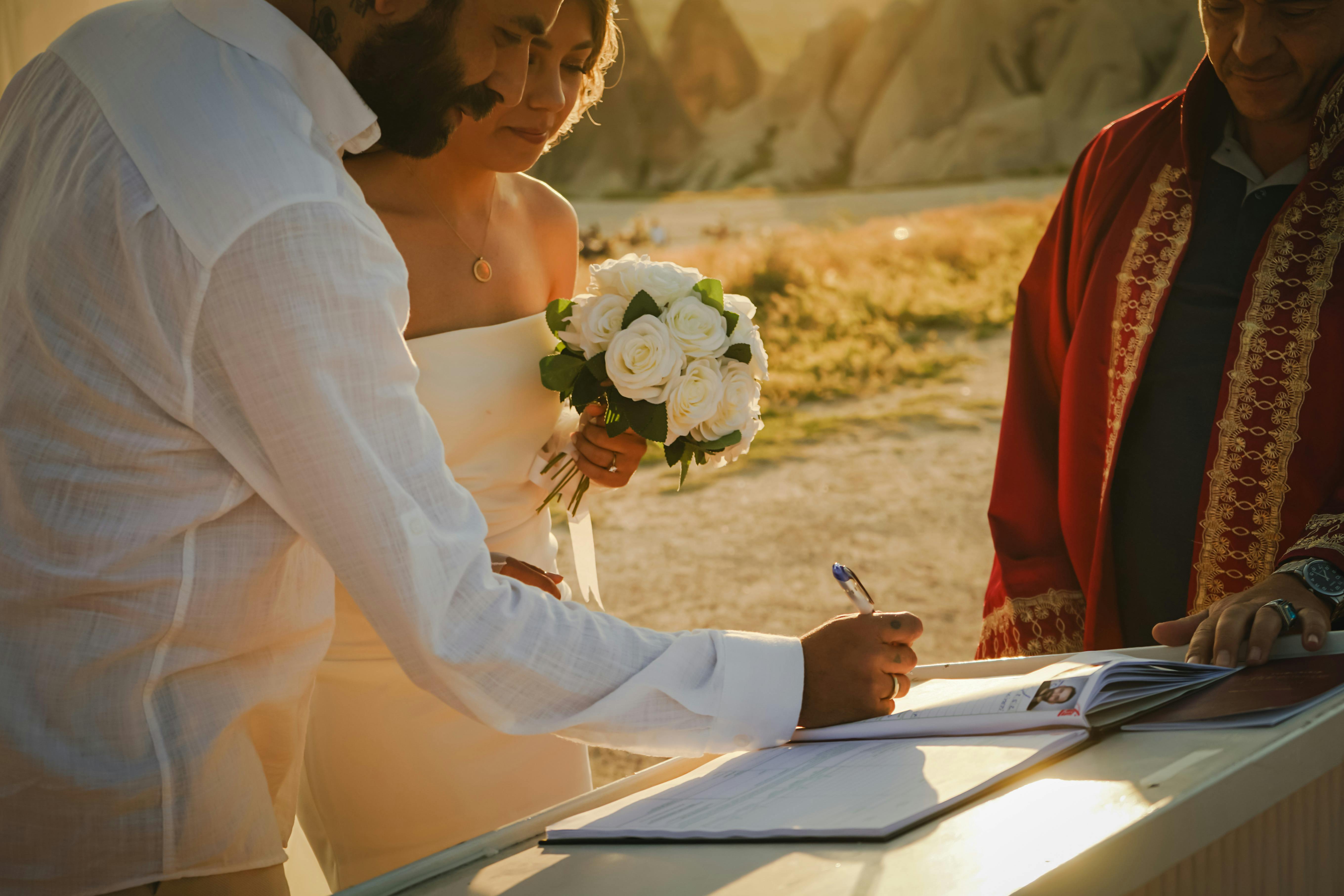 Groom Signing Wedding Documents · Free Stock Photo