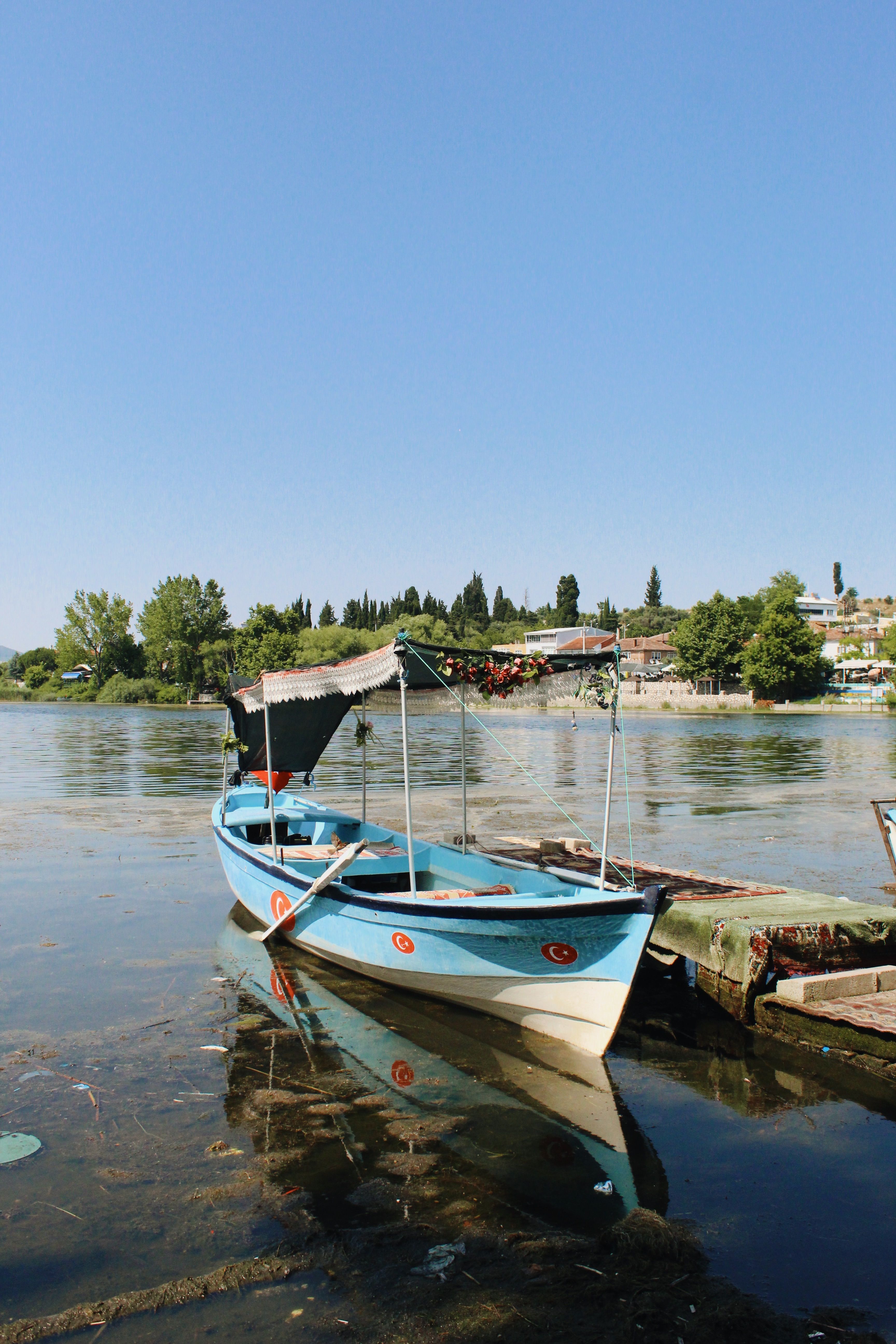 Roofed Boat Moored on Jetty · Free Stock Photo