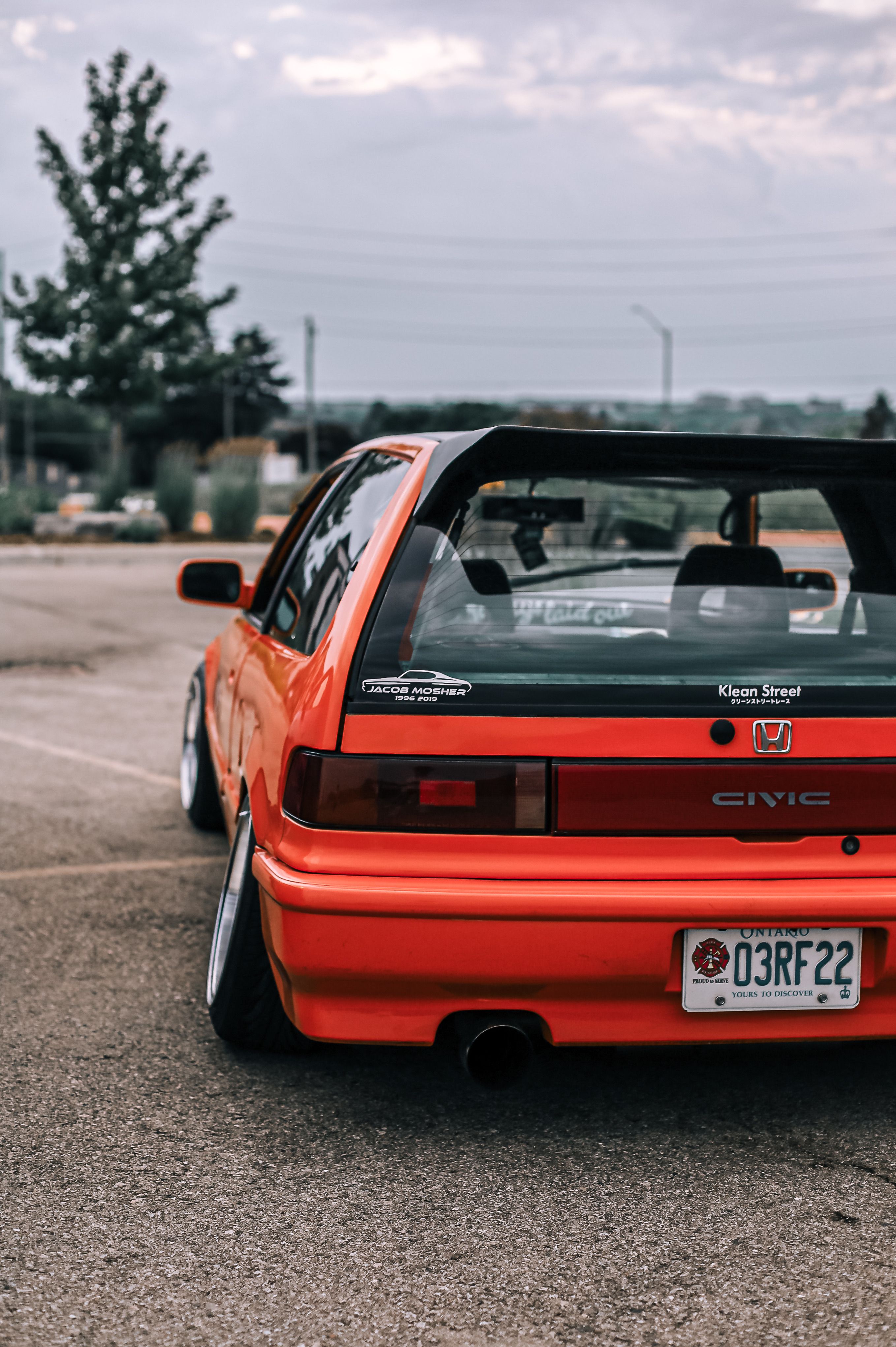 A Red Car on an Asphalt Road · Free Stock Photo