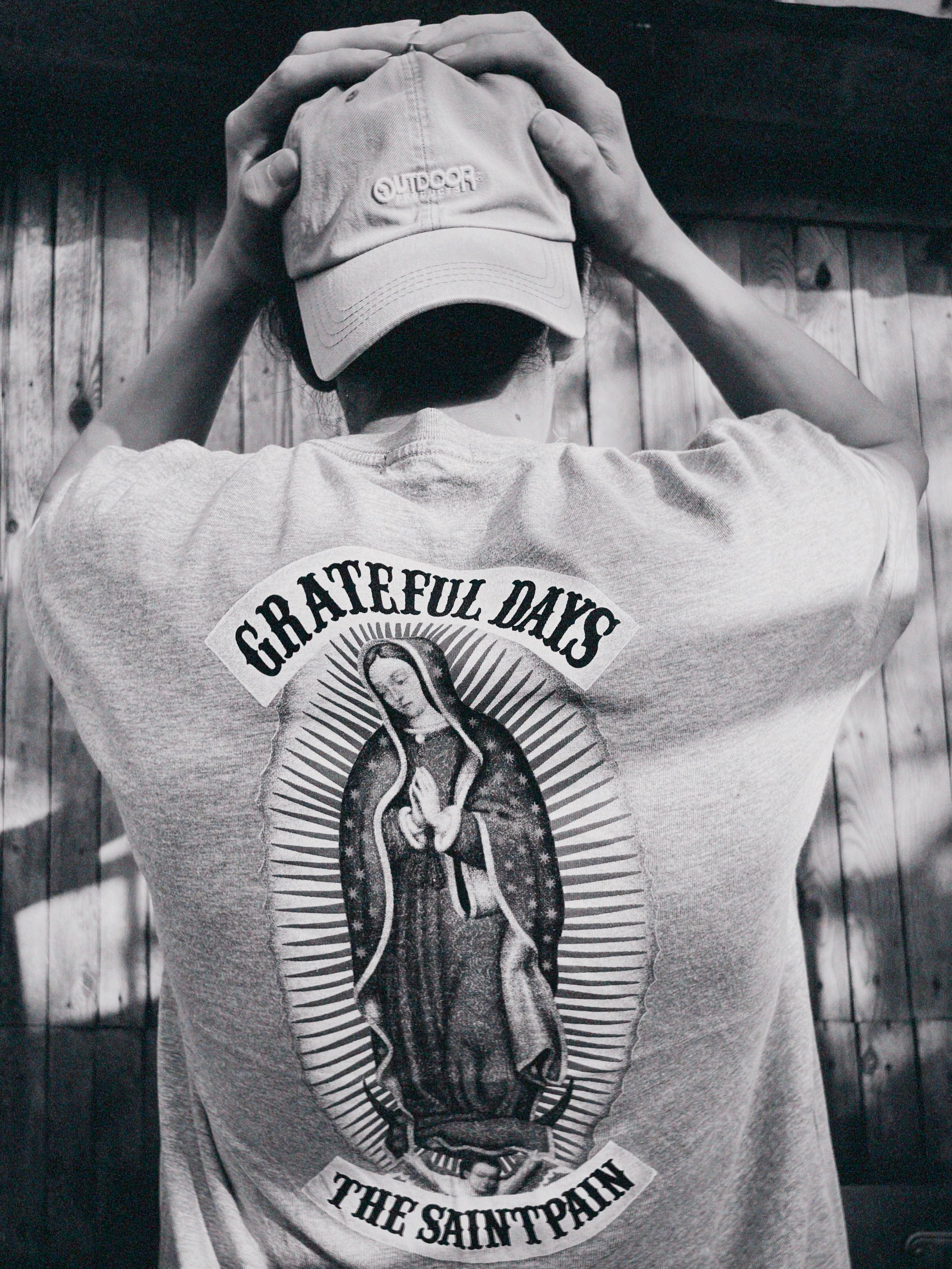 Back View of Person with Virgin Mary on T-shirt · Free Stock Photo