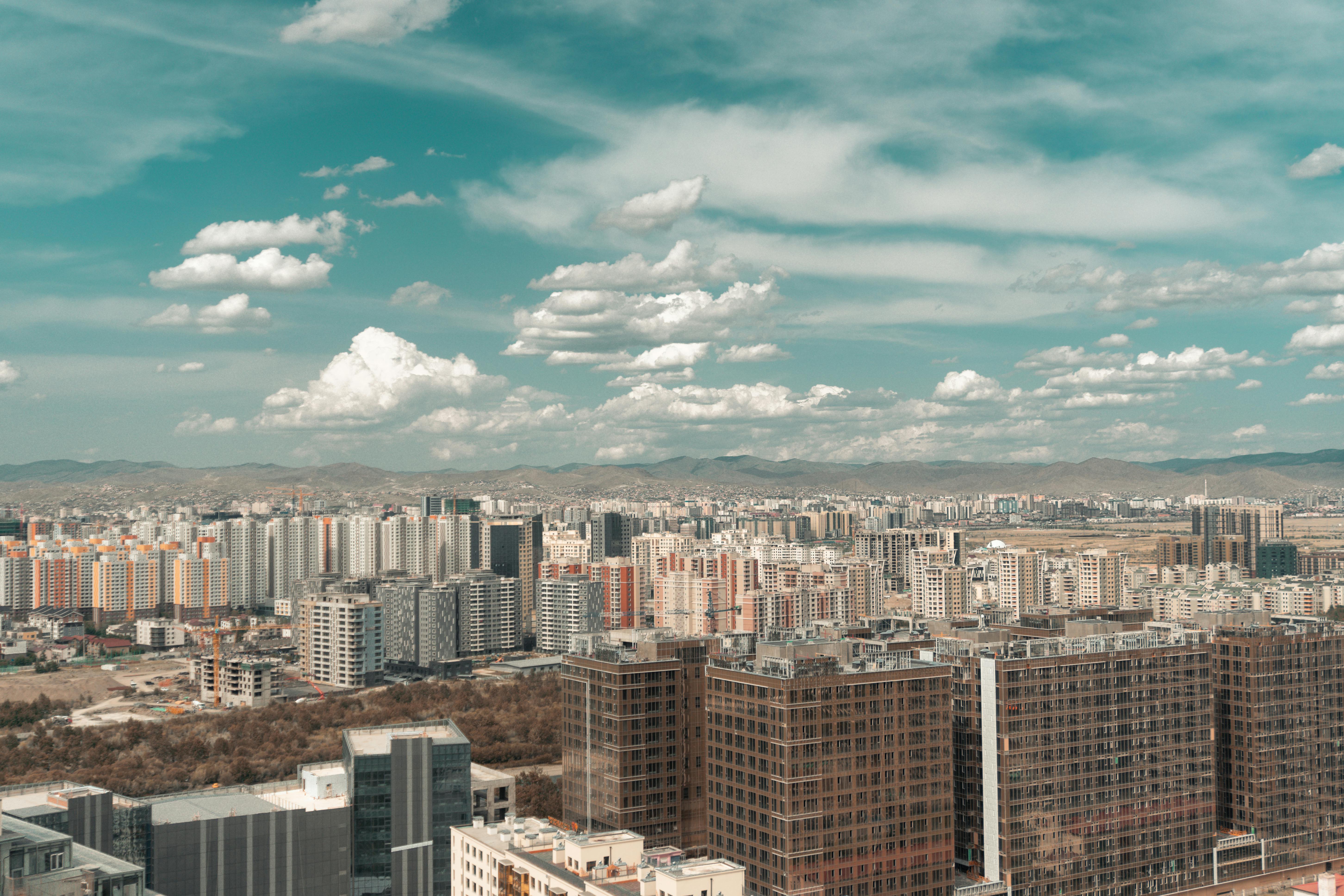 Aerial View of Contemporary Blocks in City and Hills in the Horizon ...