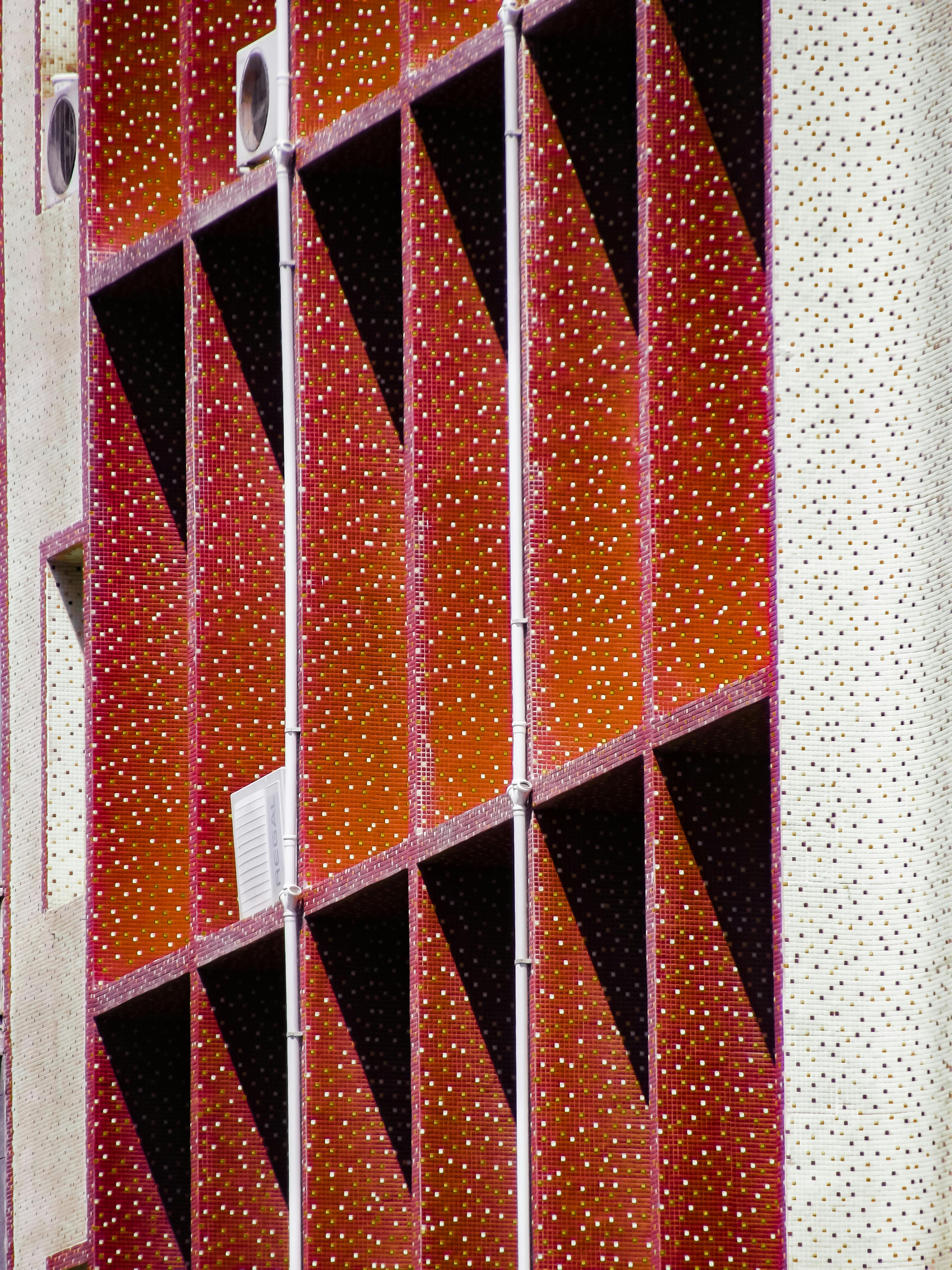 Dotted Walls of a Residential Building · Free Stock Photo