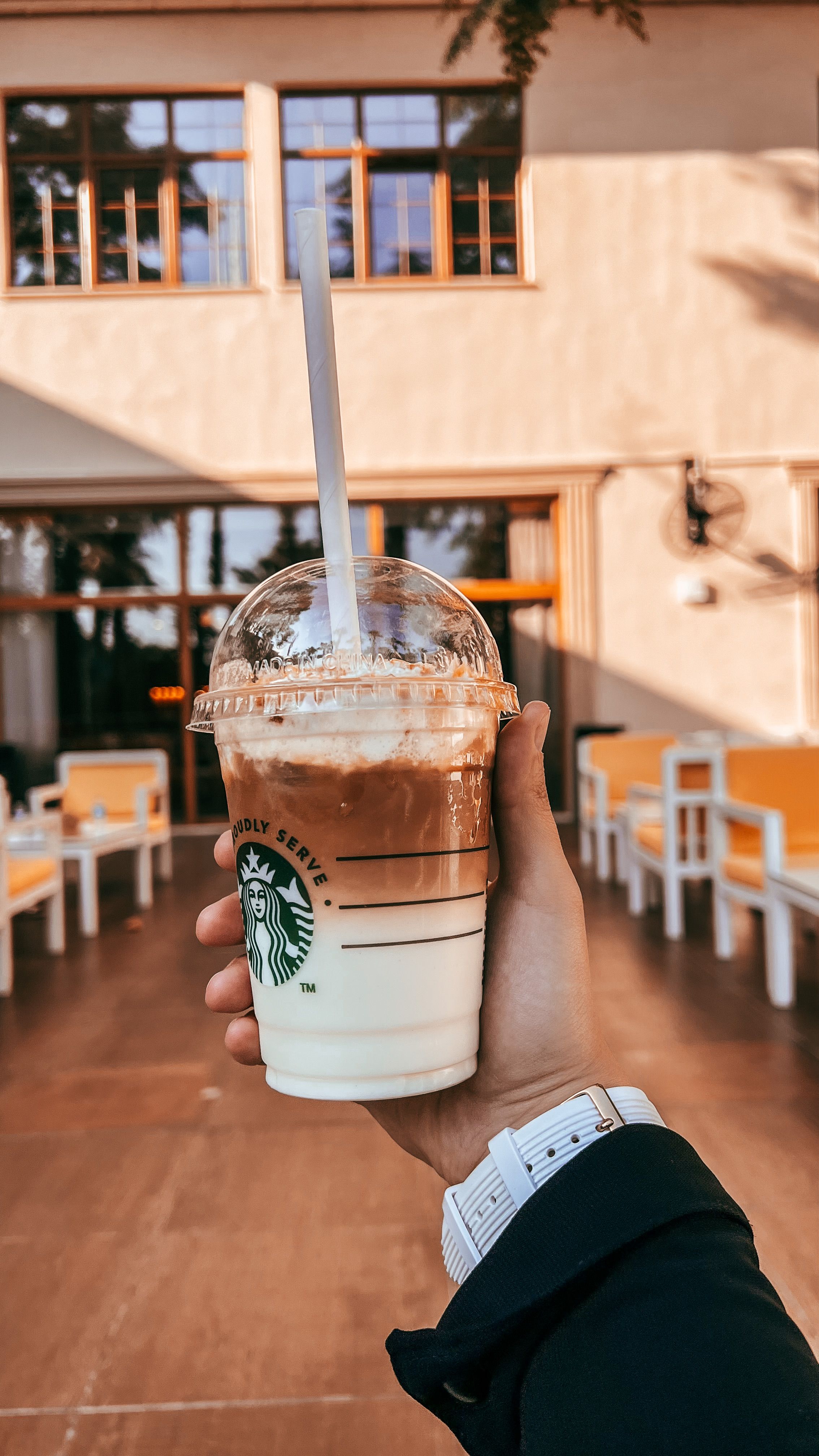 Hand Holding Starbucks Coffee · Free Stock Photo