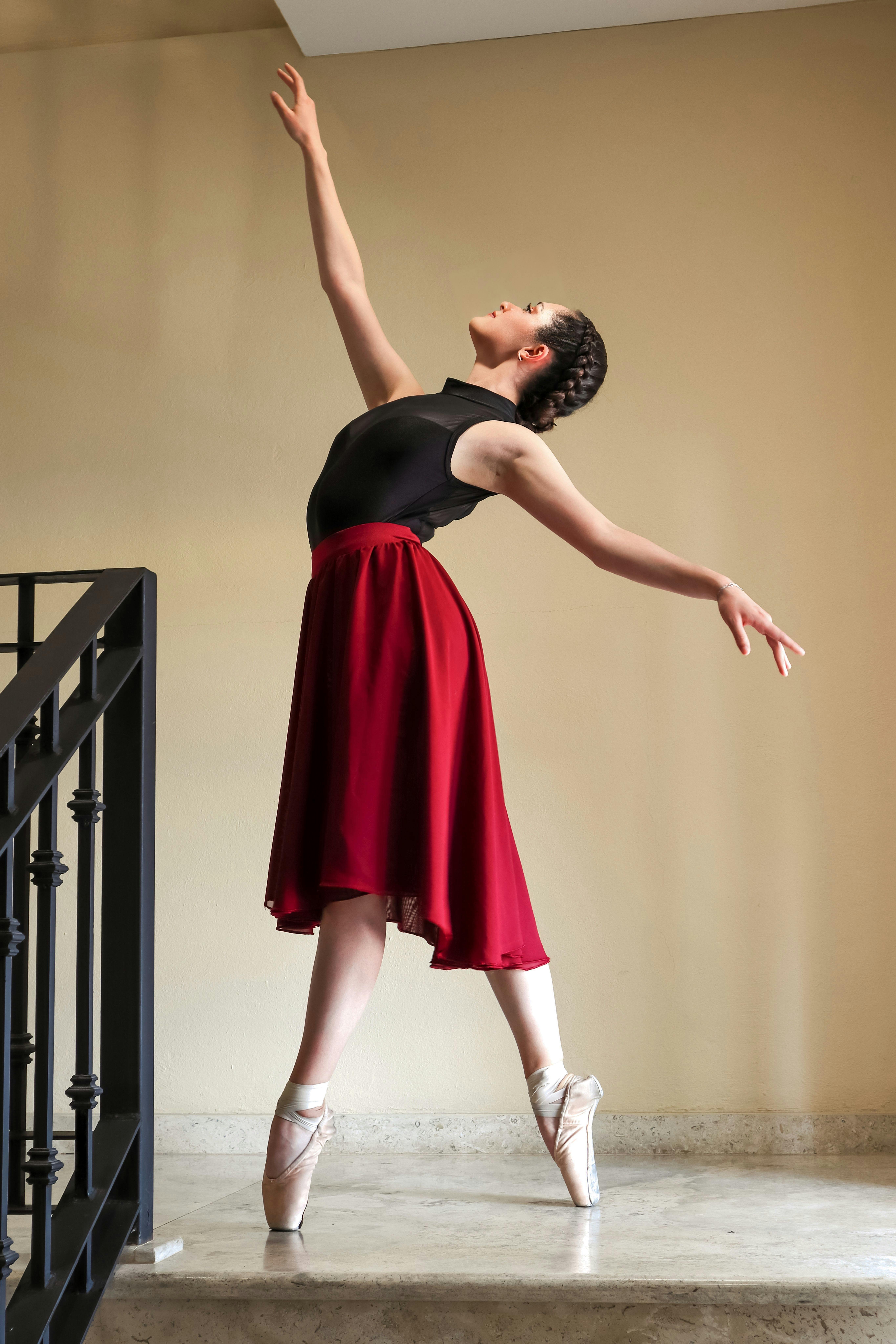 Ballerina Dancing Near the Concrete Arch Wall · Free Stock Photo