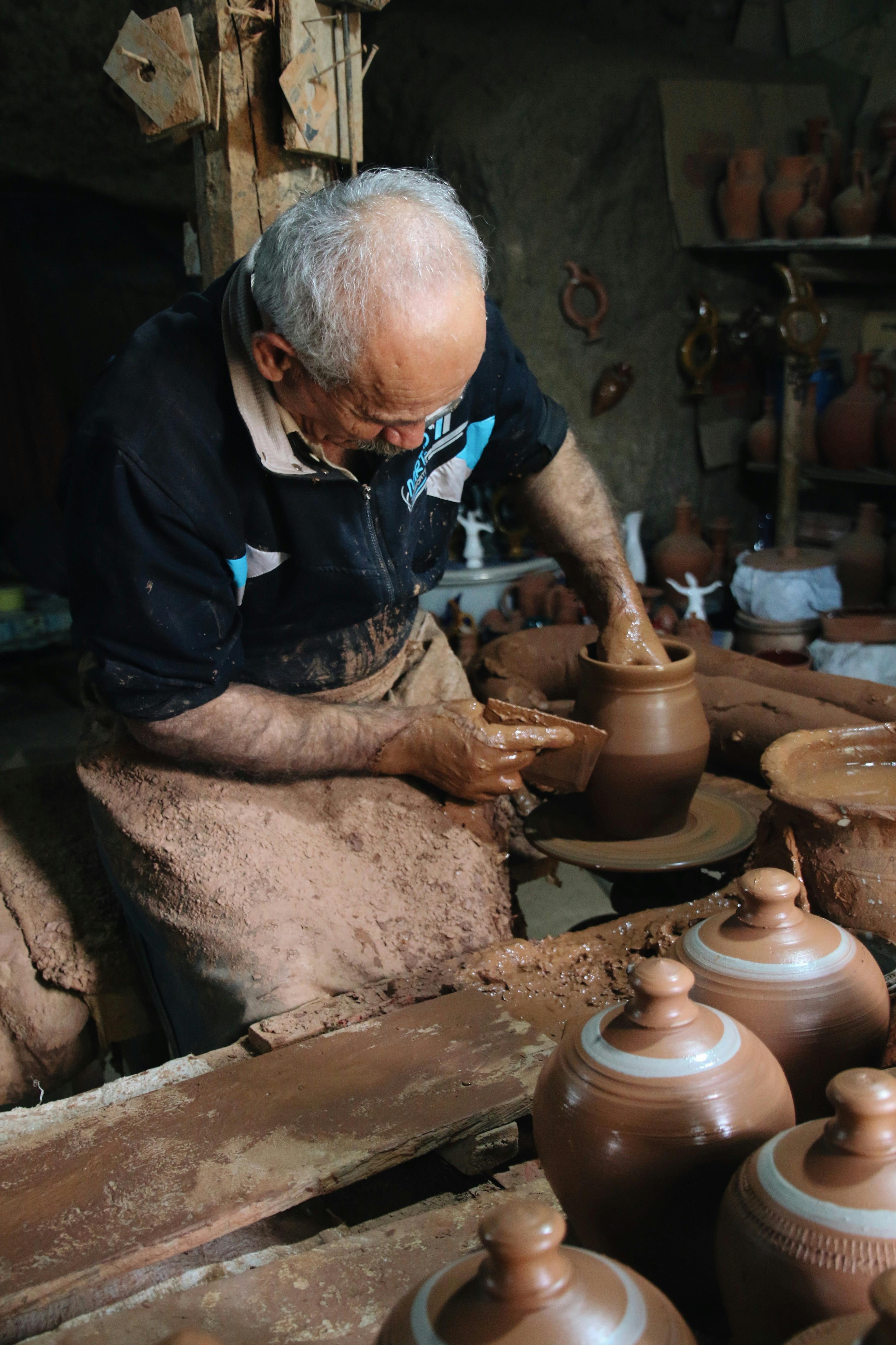 A Man Making Pot from Clay · Free Stock Photo