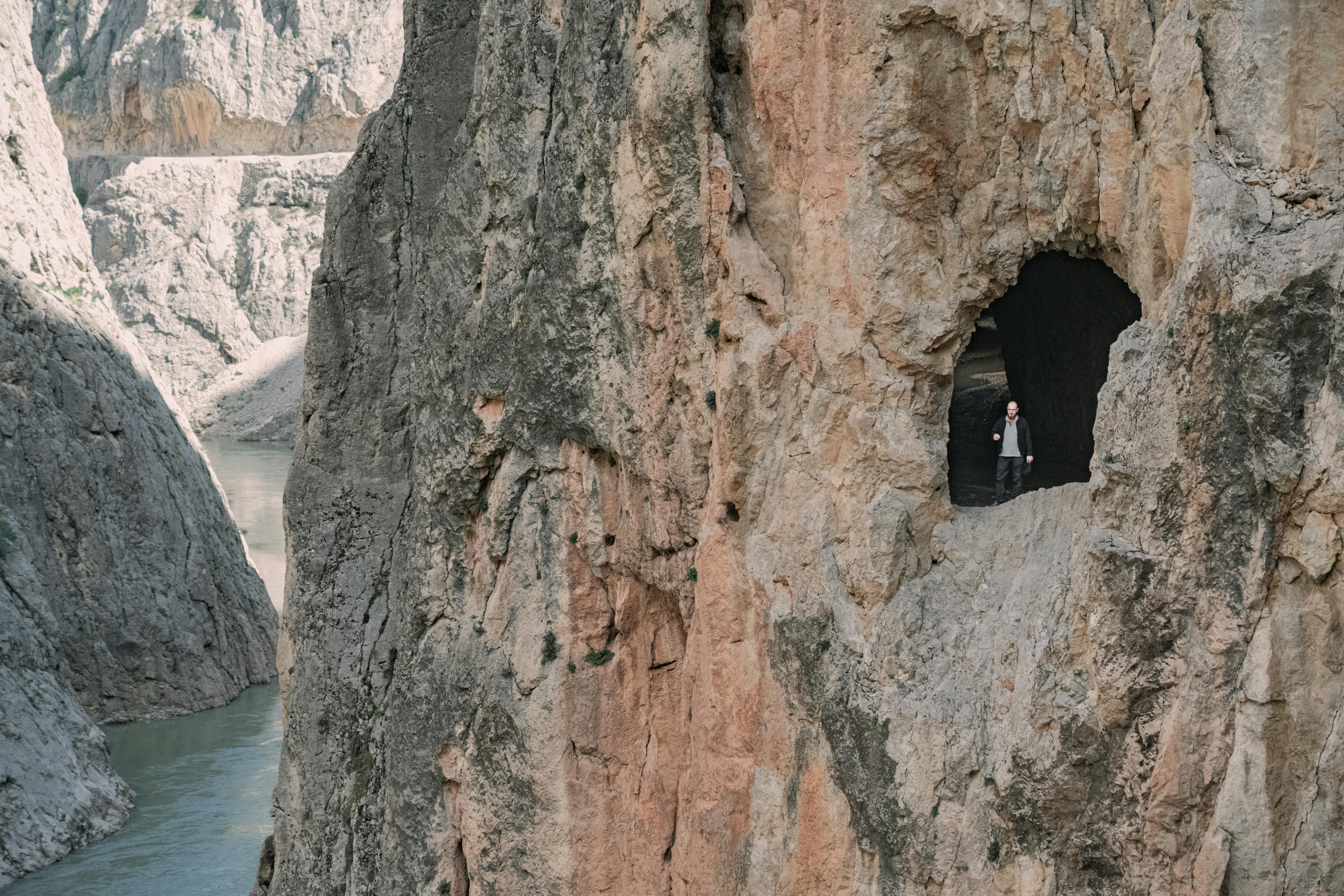 Man Standing in a Cave · Free Stock Photo