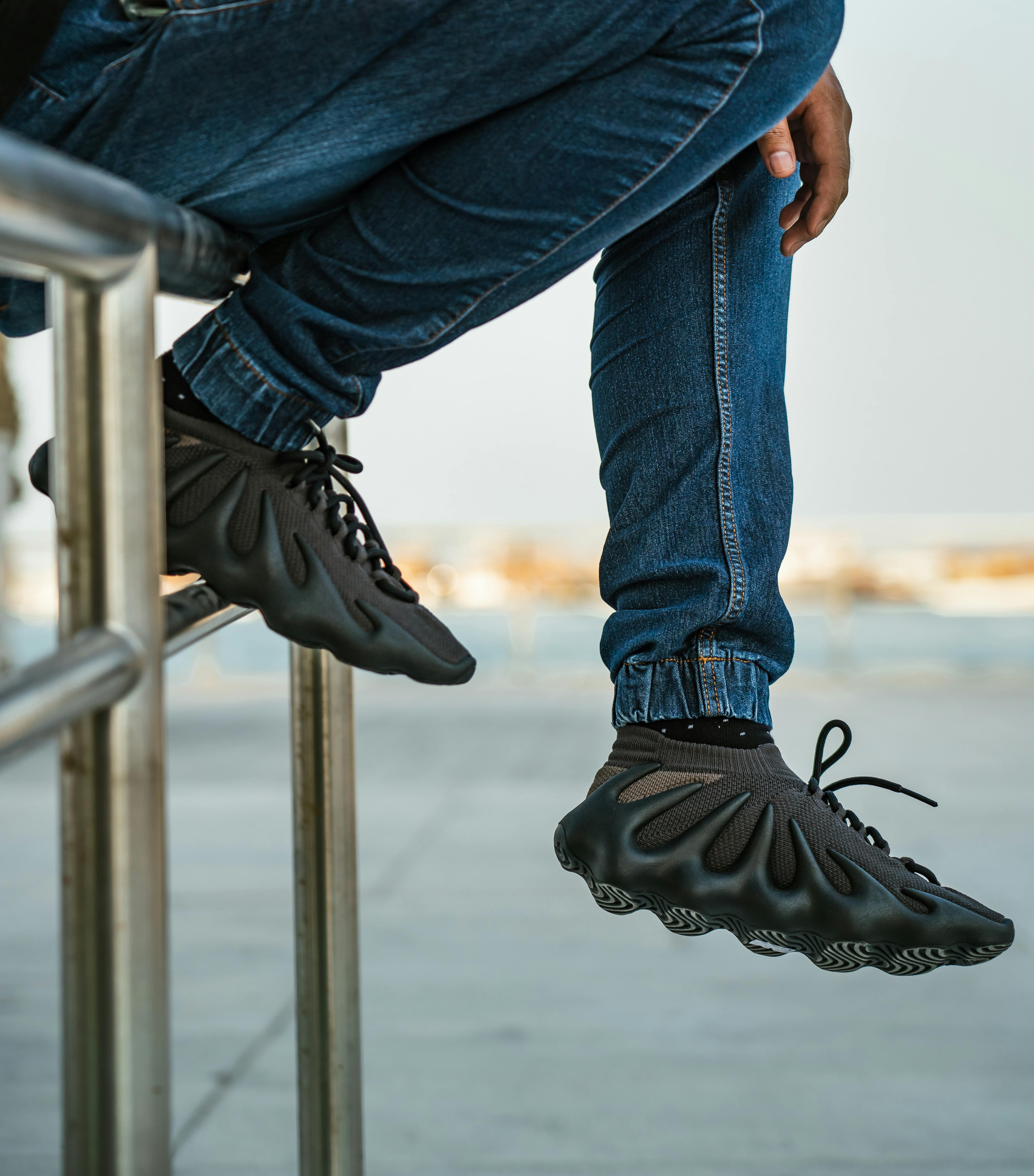 Man Sitting on the Railing · Free Stock Photo