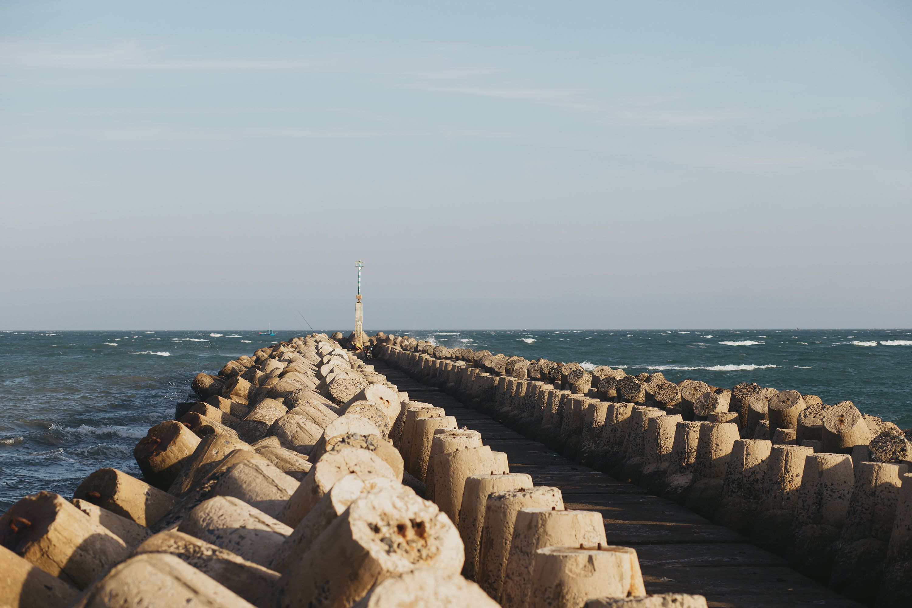 Aerial View of a Breakwater on a Sea · Free Stock Photo