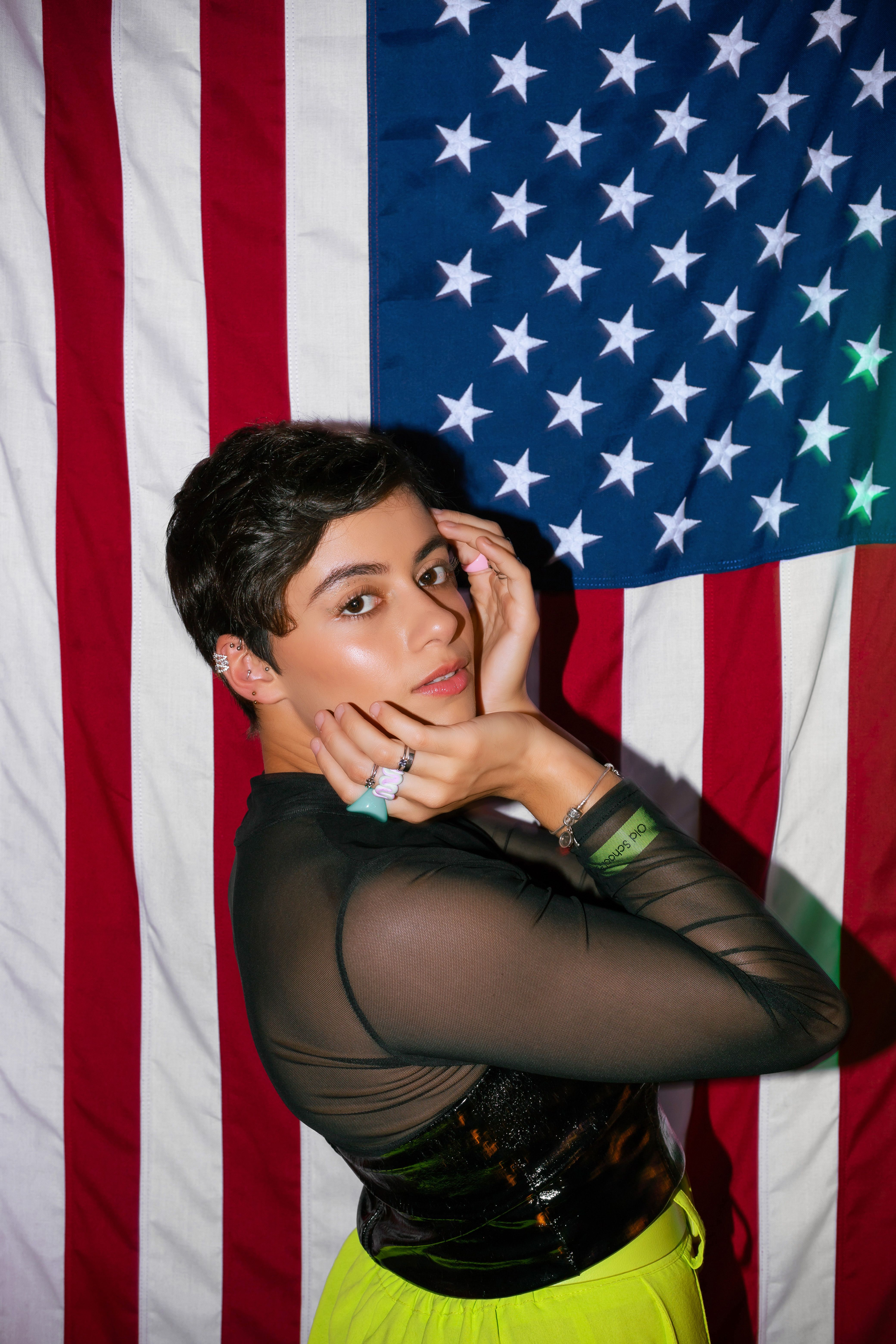 Woman Posing with American Flag behind · Free Stock Photo