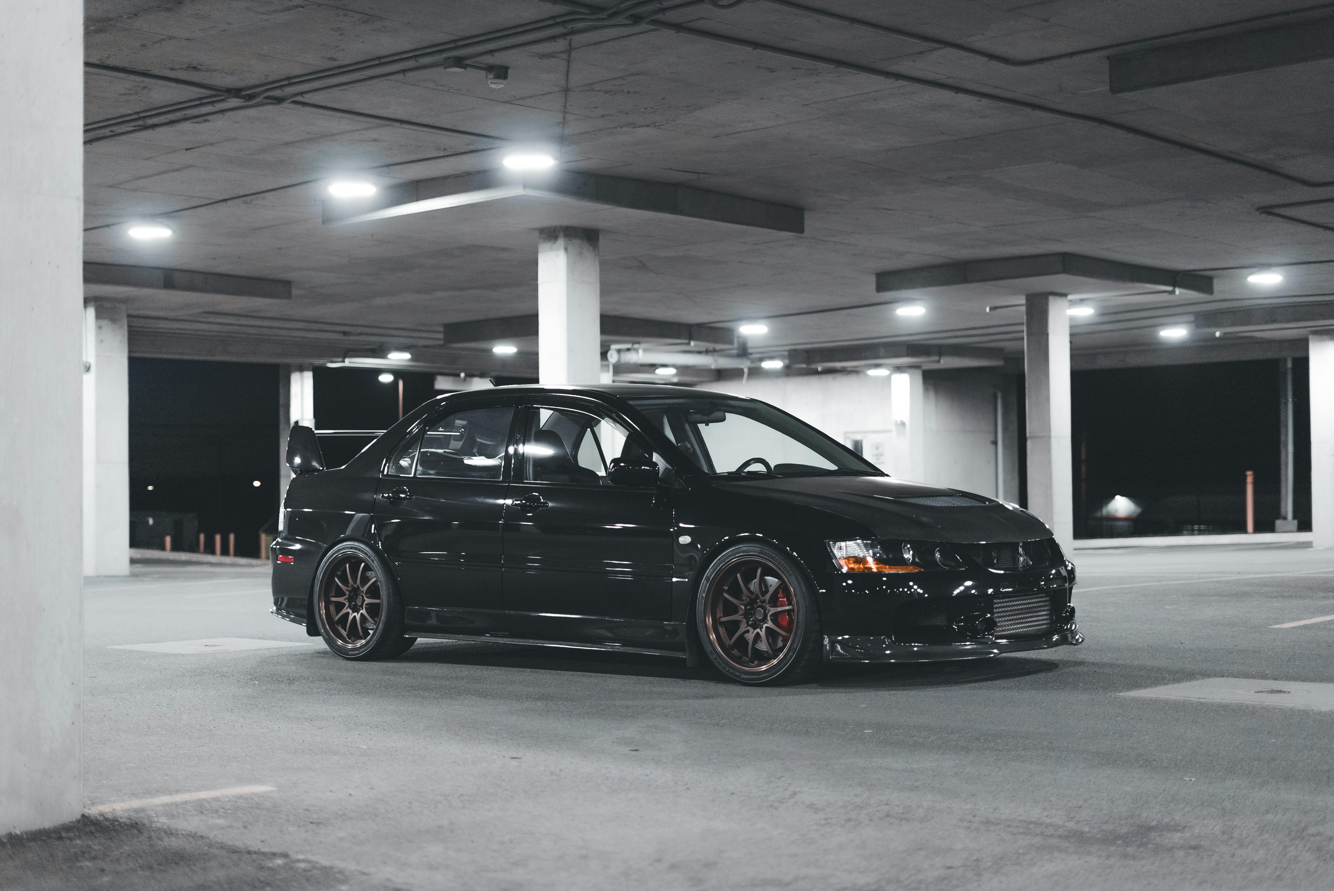 Red Mitsubishi Lancer Evolution at Night · Free Stock Photo