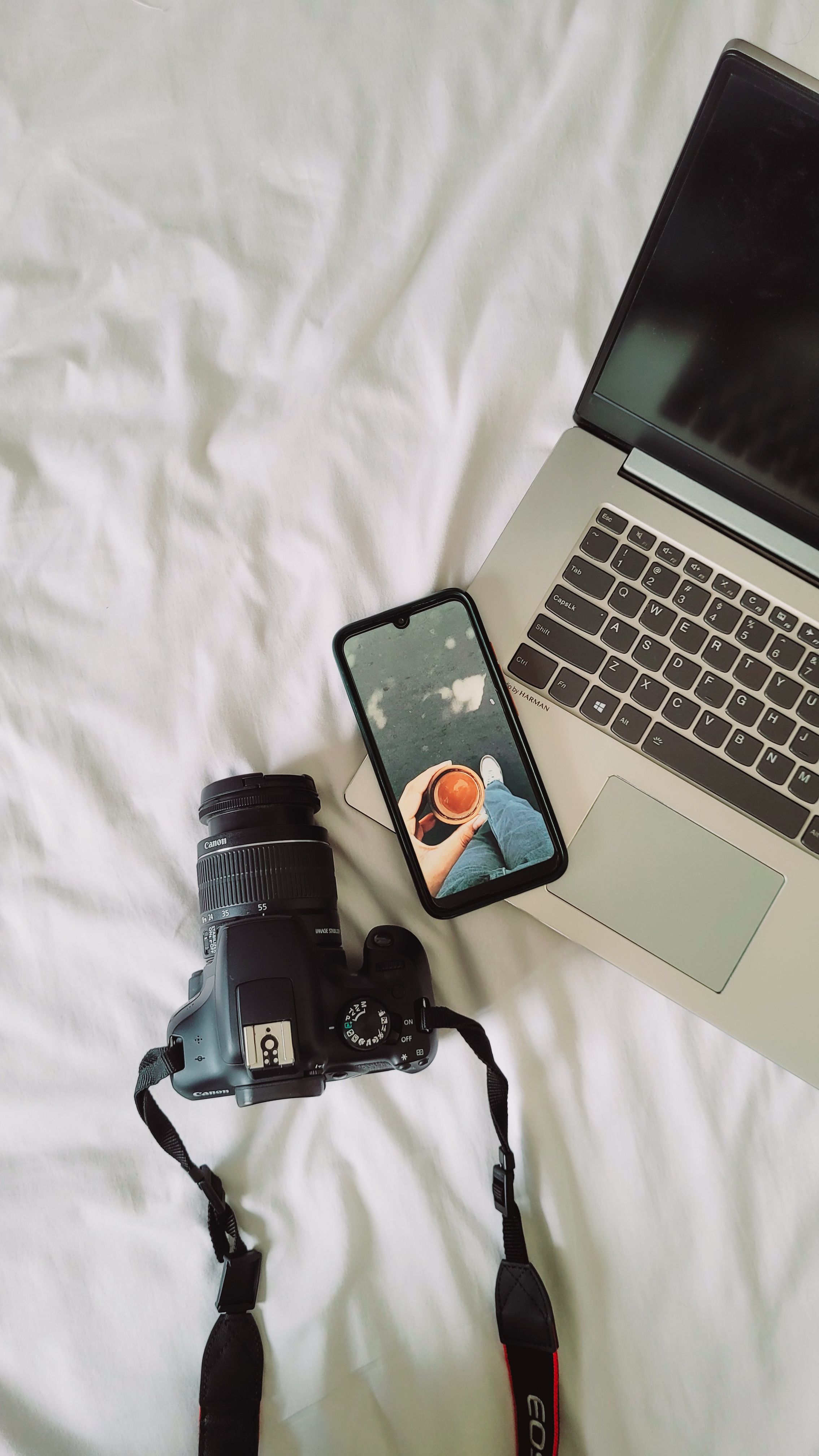 Smartphone and Laptop and Camera on Bed · Free Stock Photo