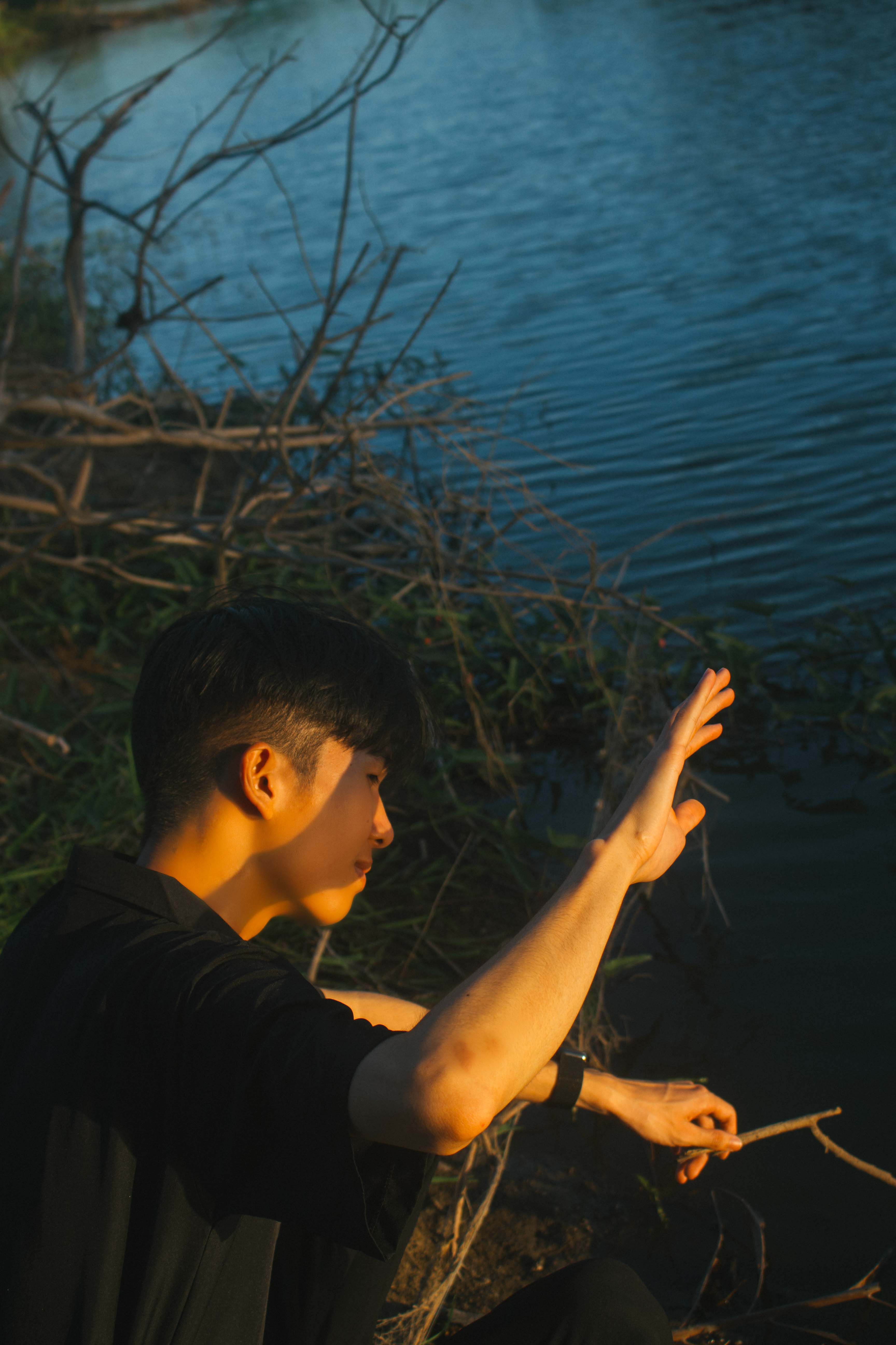 Boy Shielding his Face from the Sunlight · Free Stock Photo