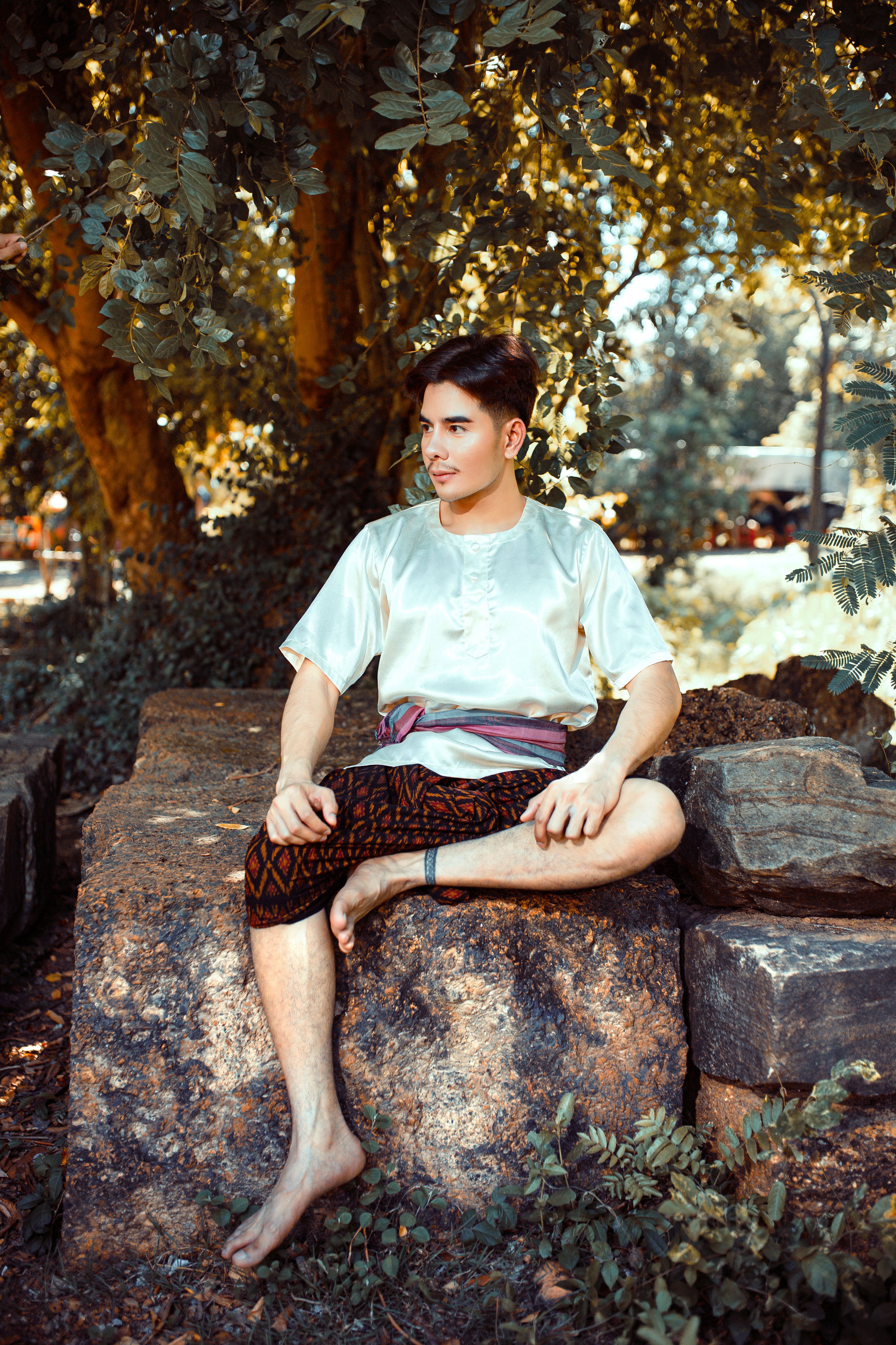 Man Sitting on Stone · Free Stock Photo