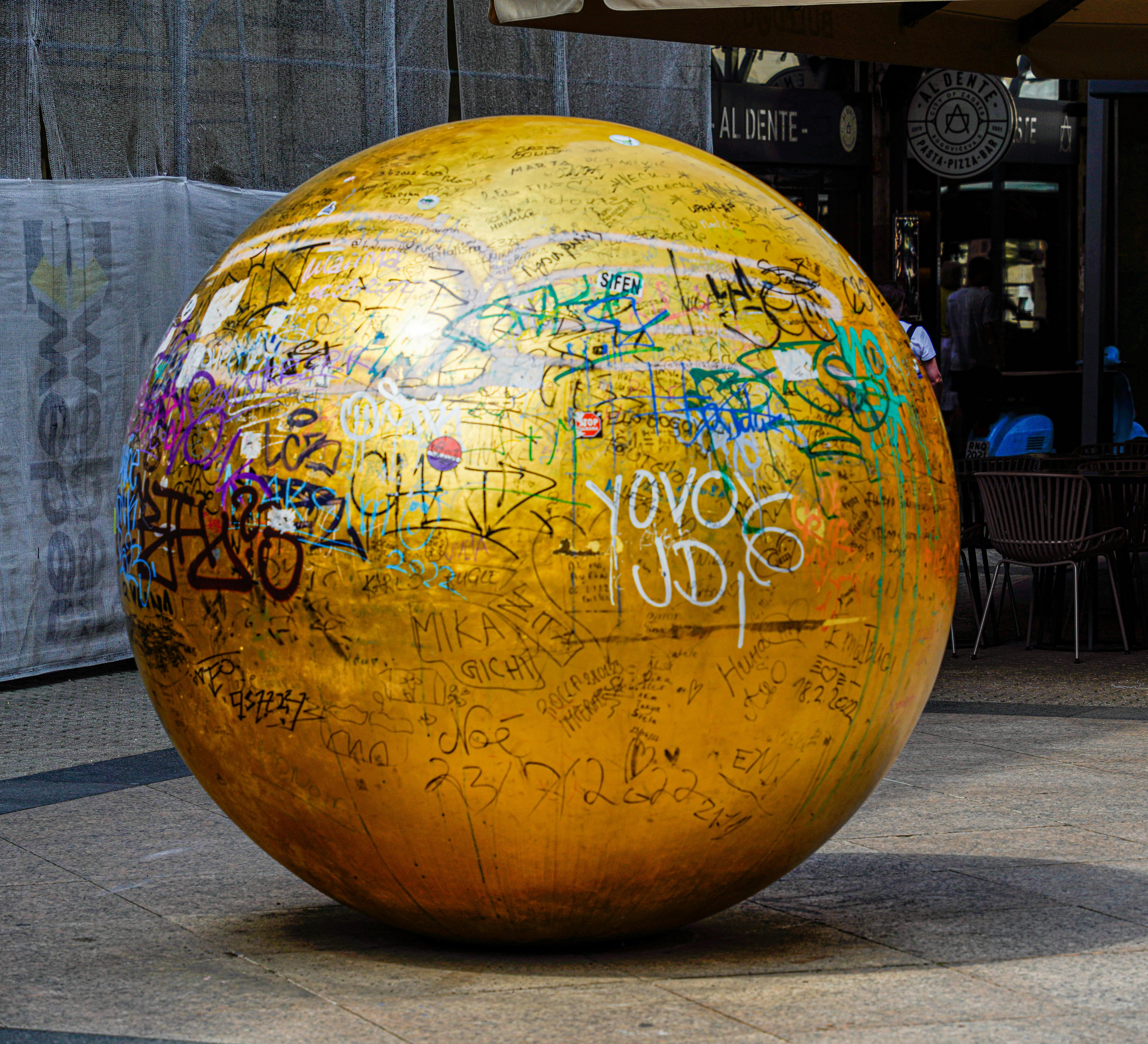Golden Ball on the Sidewalk · Free Stock Photo