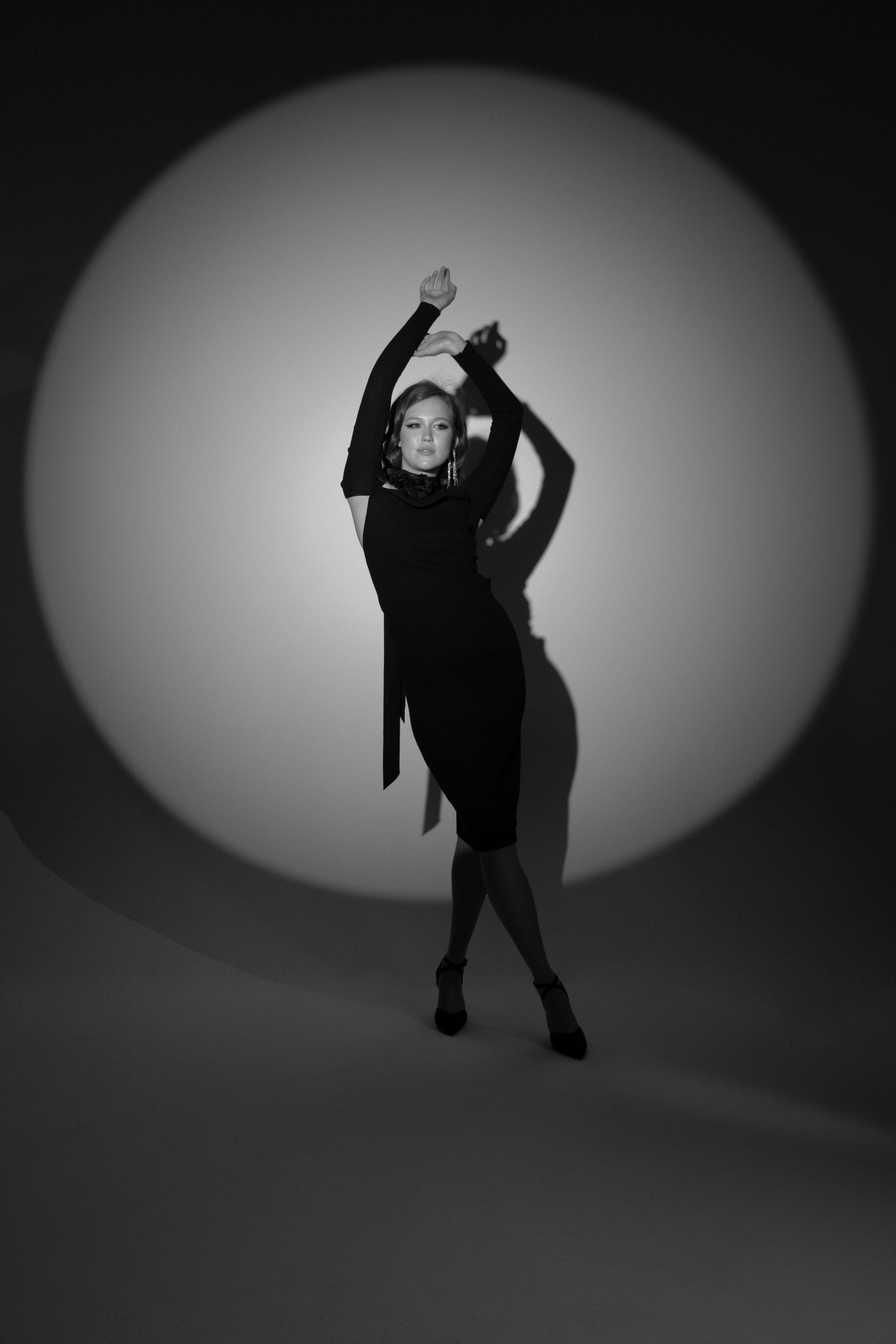 Woman Posing with Arms Raised · Free Stock Photo