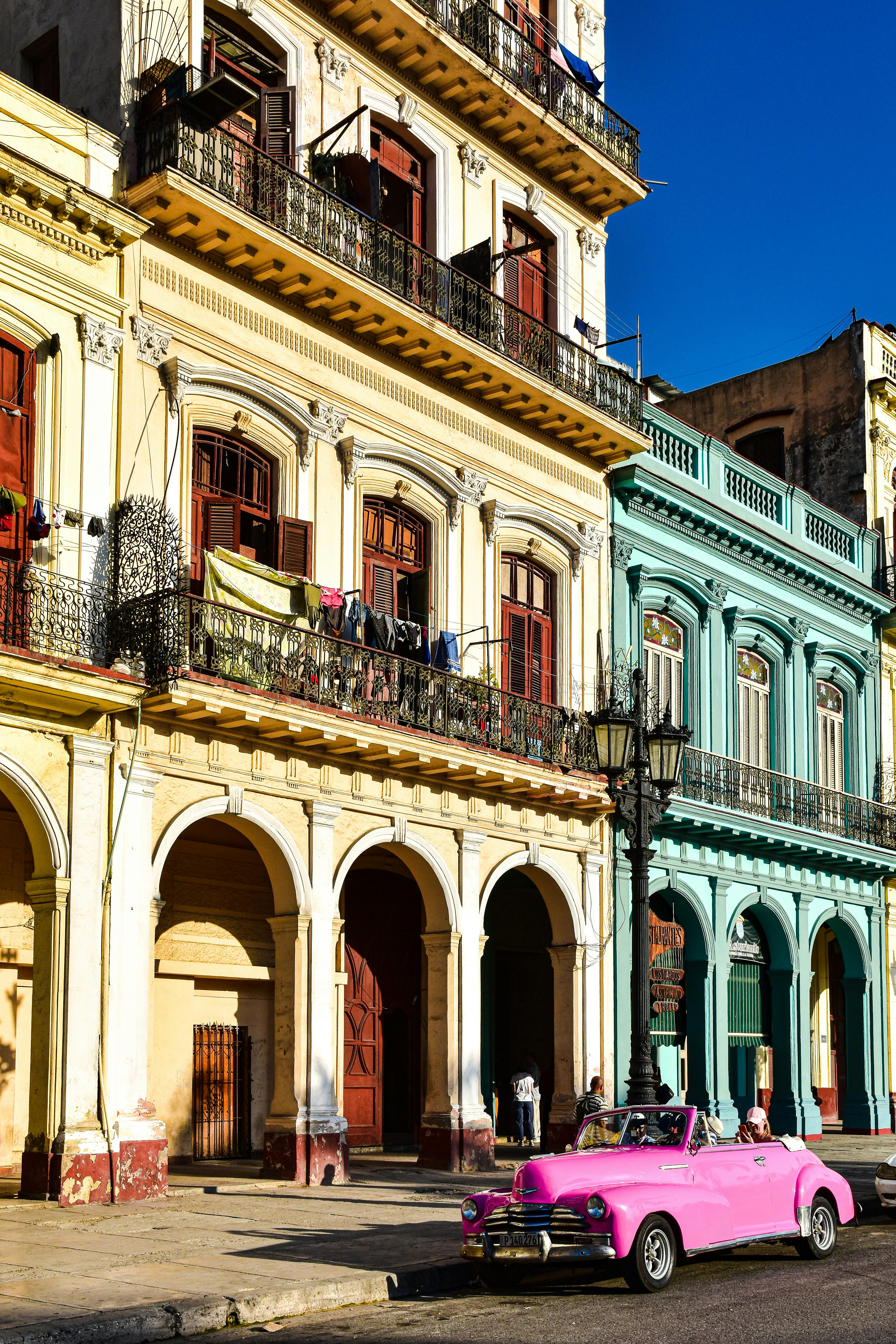 Pink, Vintage Cabriolet on Street in Town in Cuba · Free Stock Photo