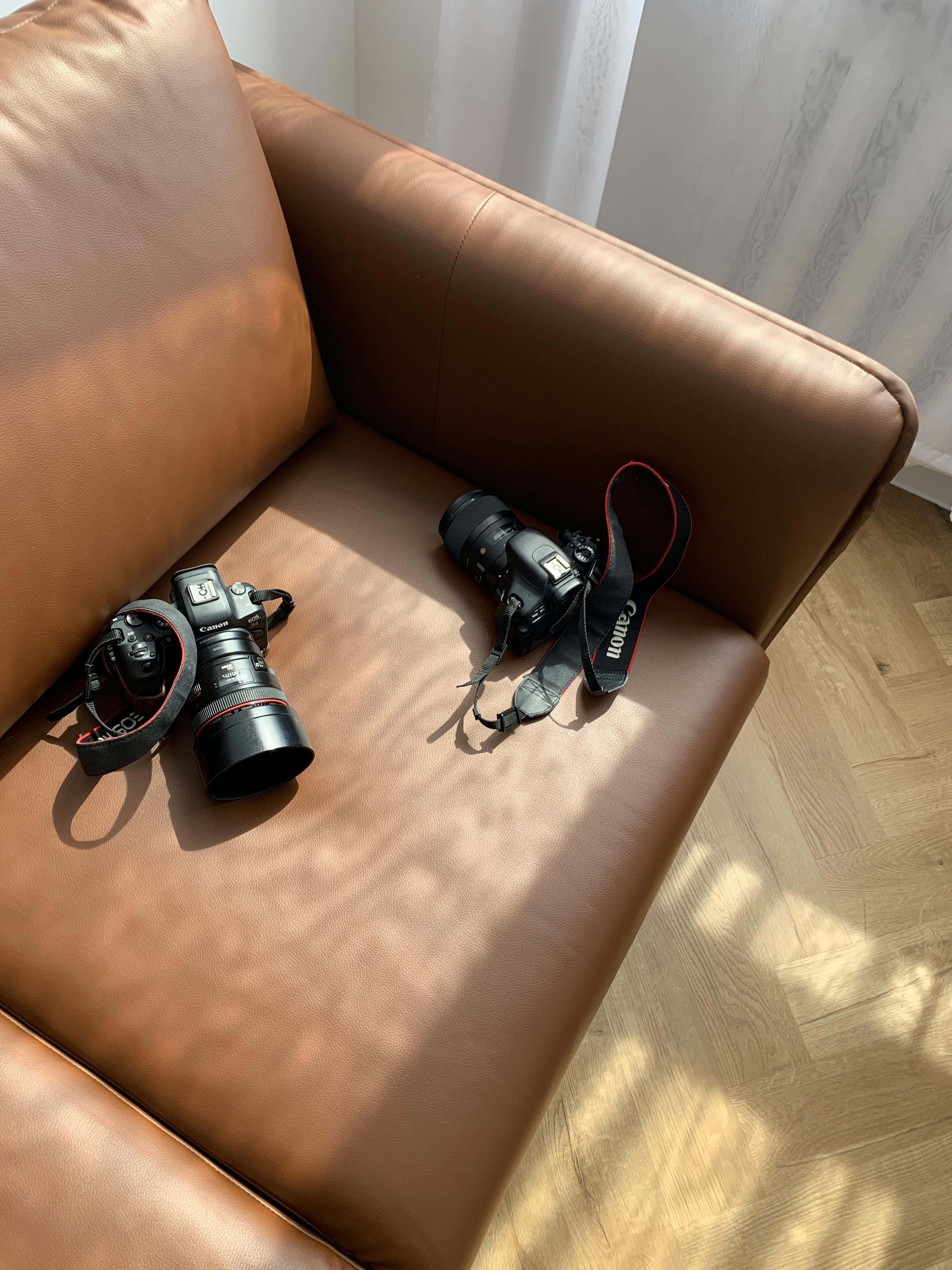 Cameras on Couch · Free Stock Photo