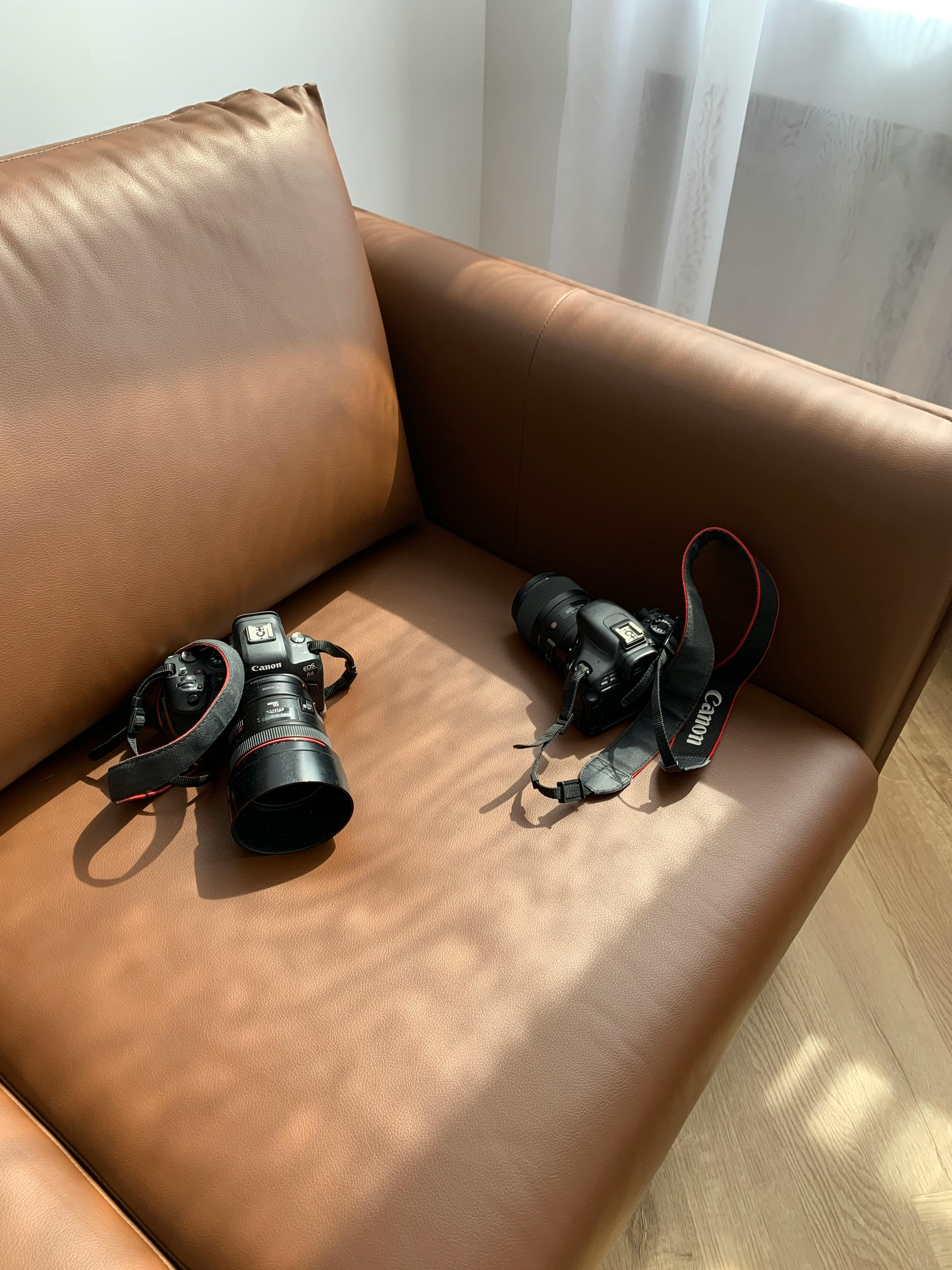 Cameras on Couch · Free Stock Photo