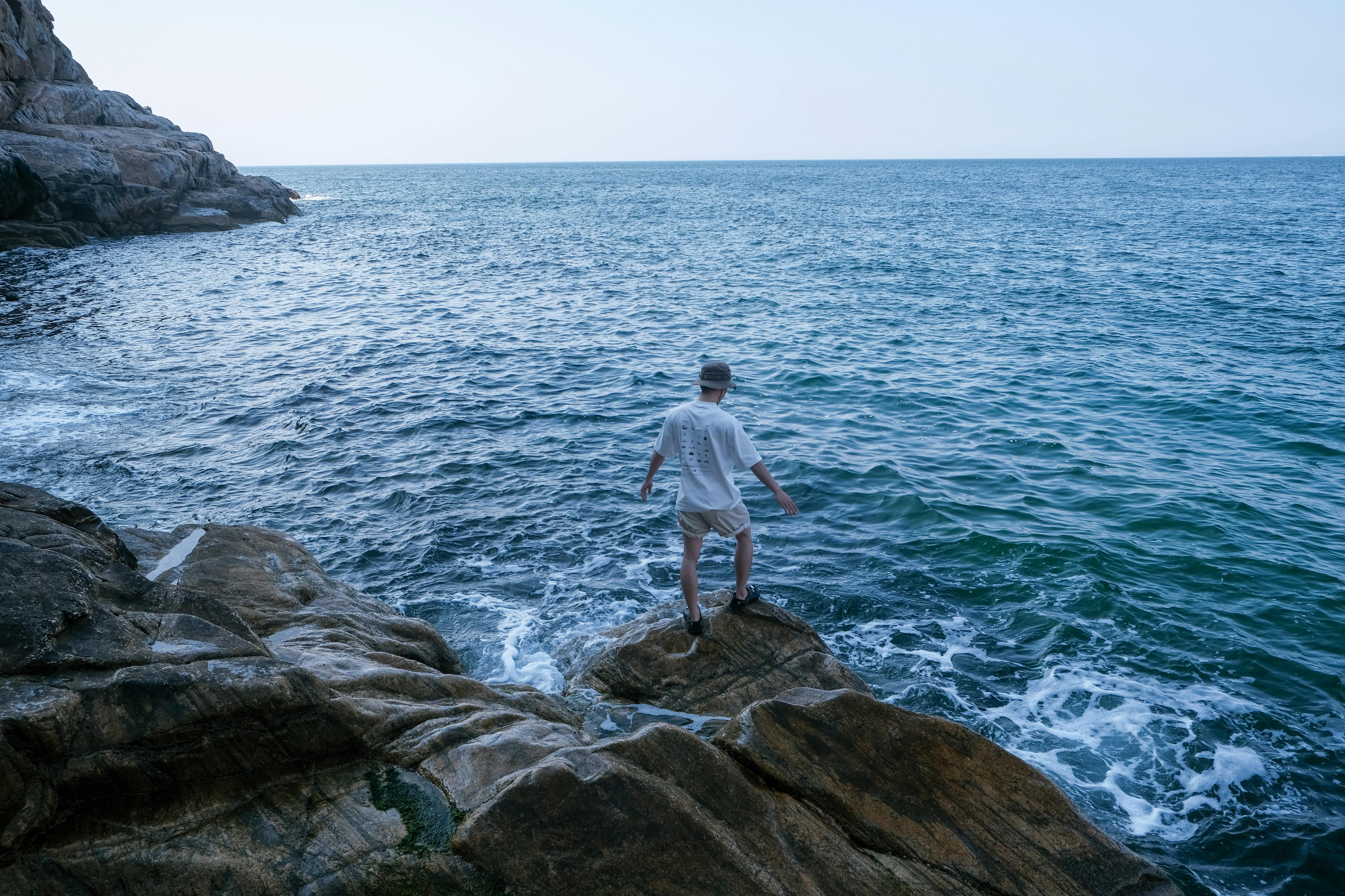 A Man Standing by a Sea · Free Stock Photo