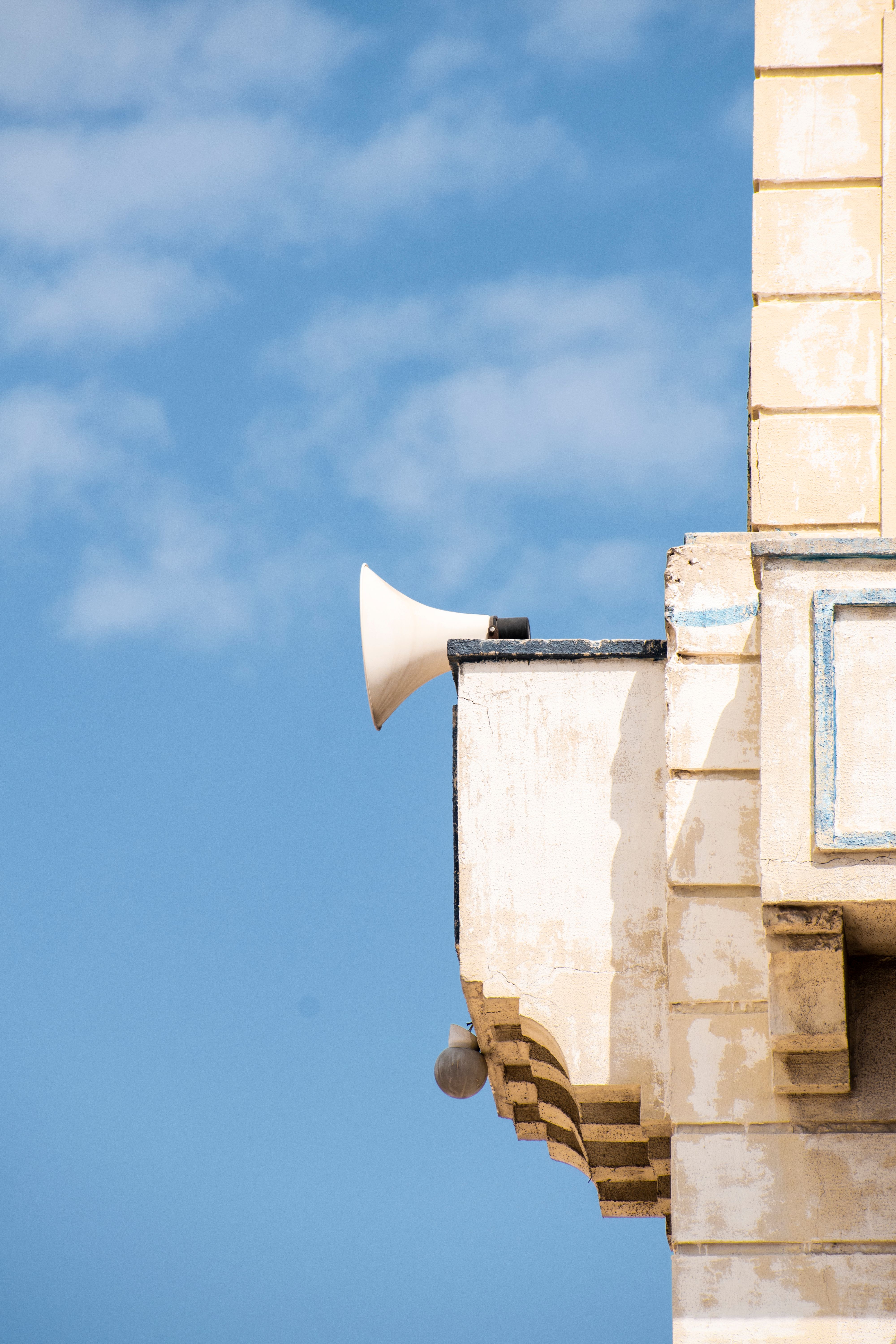 Megaphone on Building Wall · Free Stock Photo