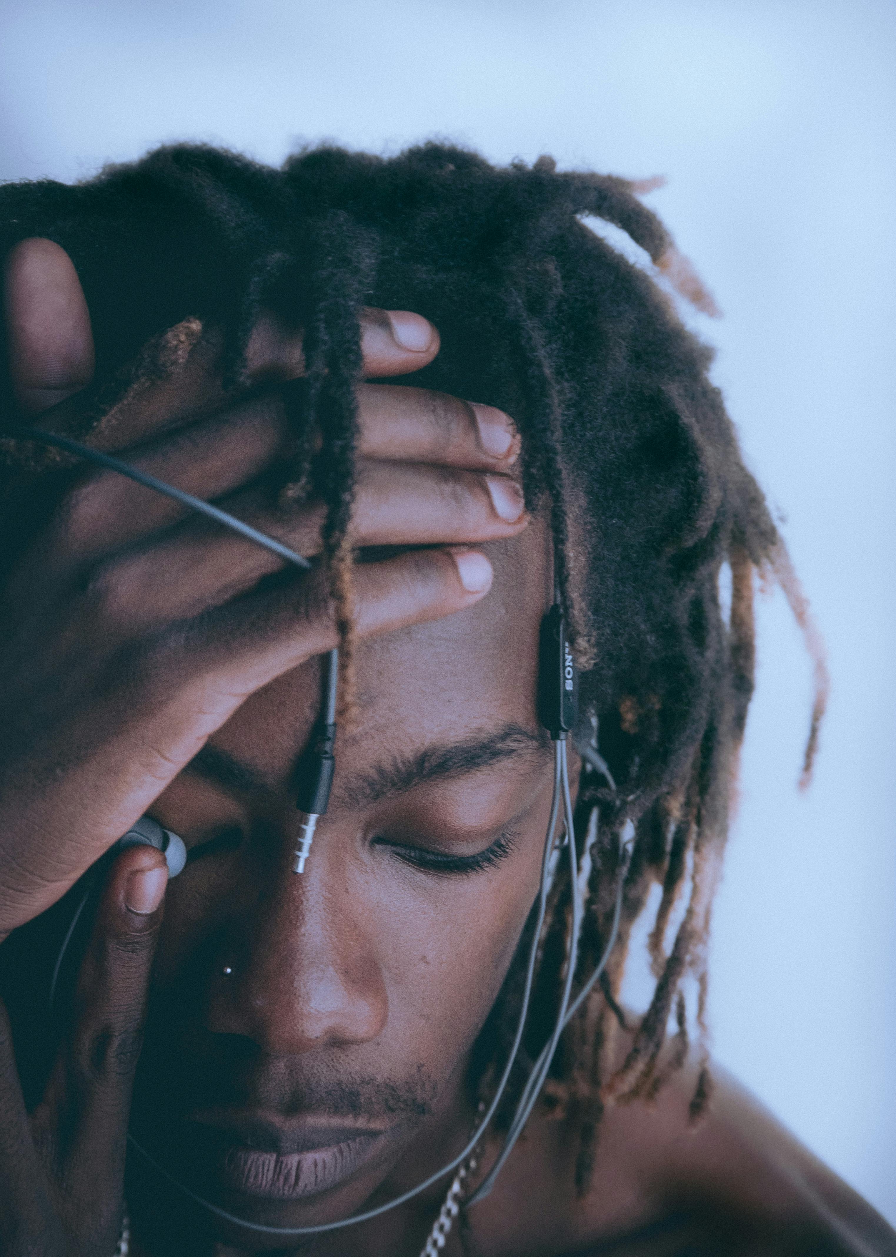 Woman Posing with Hand on Forehead in Black and White · Free Stock Photo