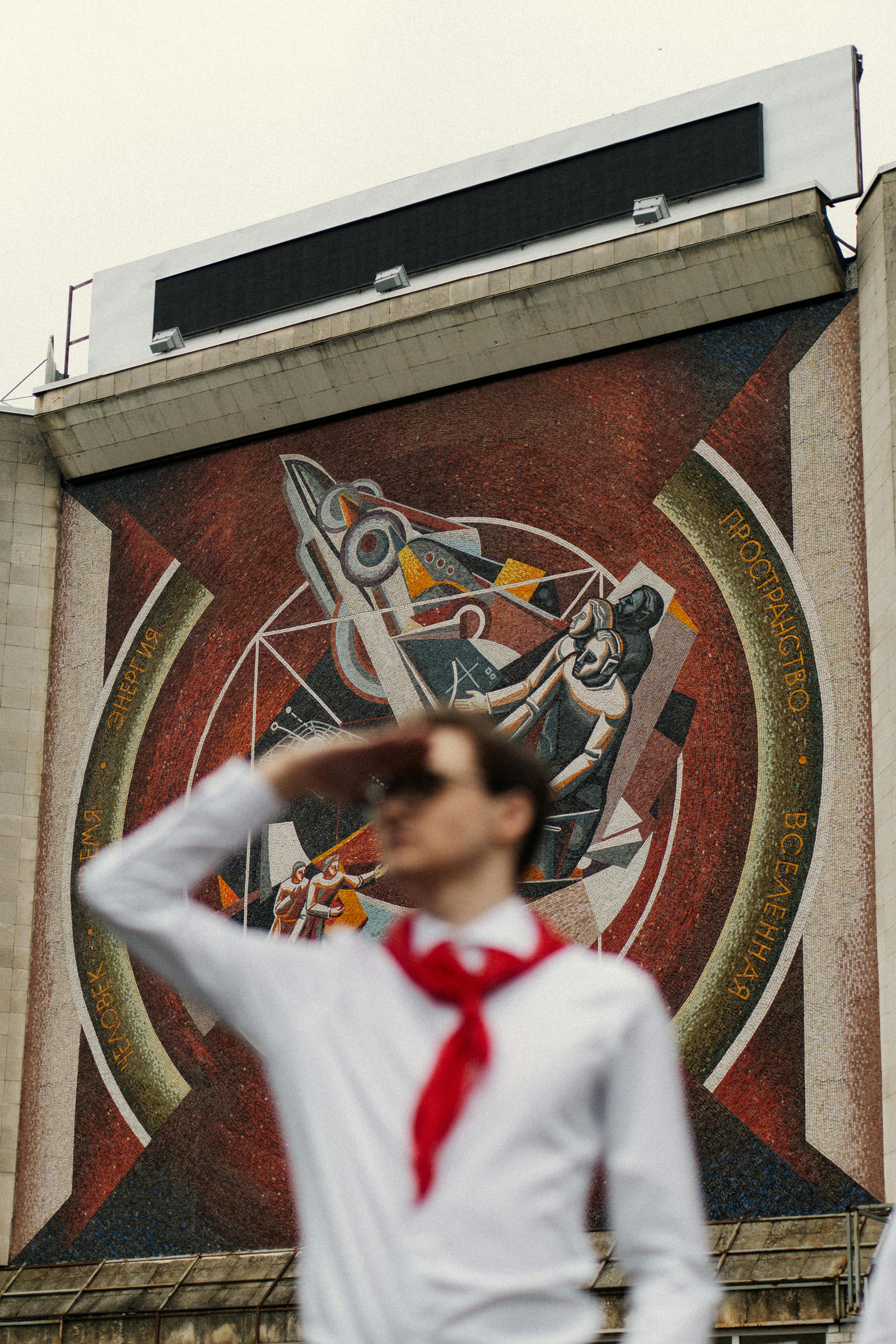 Boy in Salute Holding Indonesian Flag · Free Stock Photo