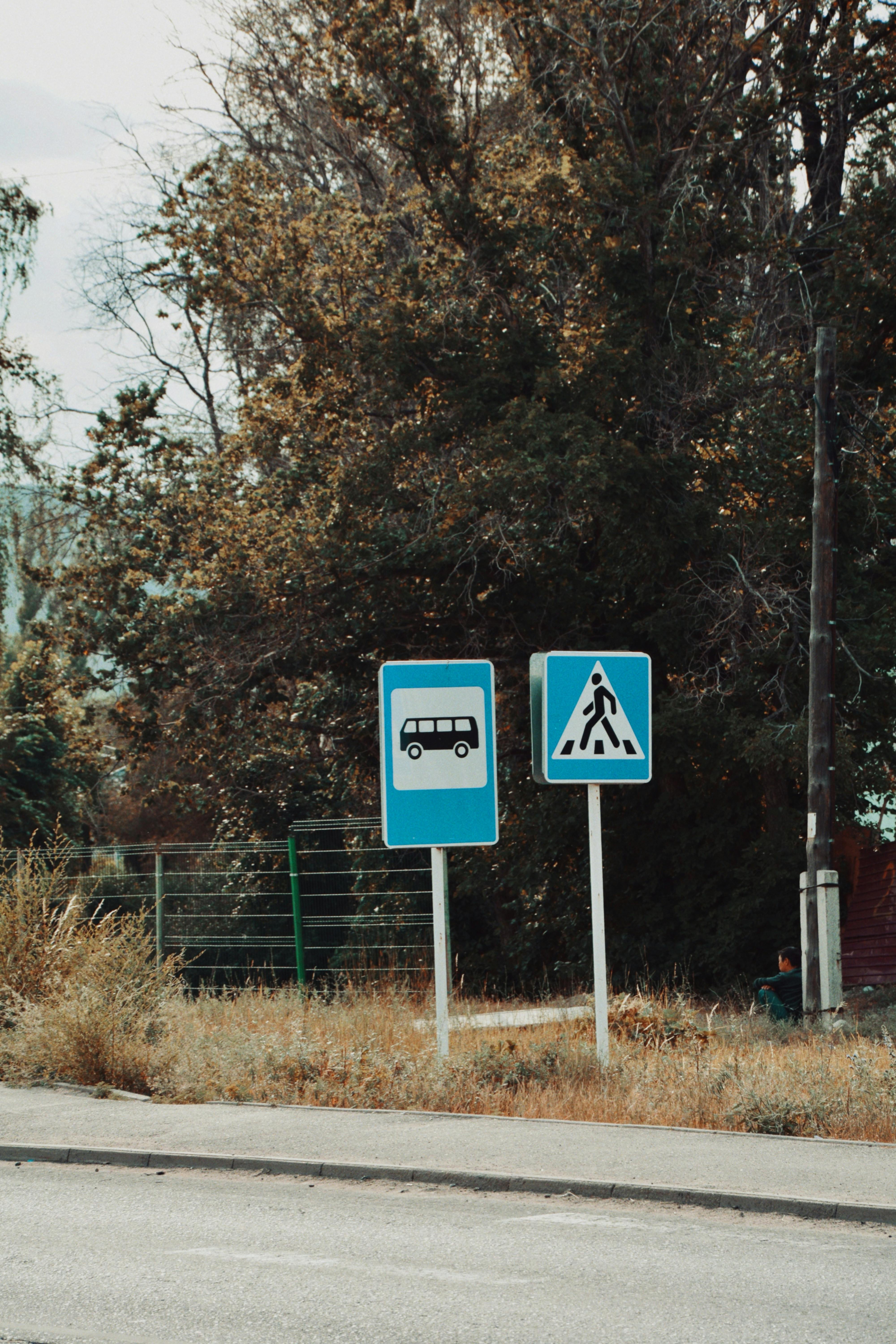 Road Signs on a Roadside · Free Stock Photo