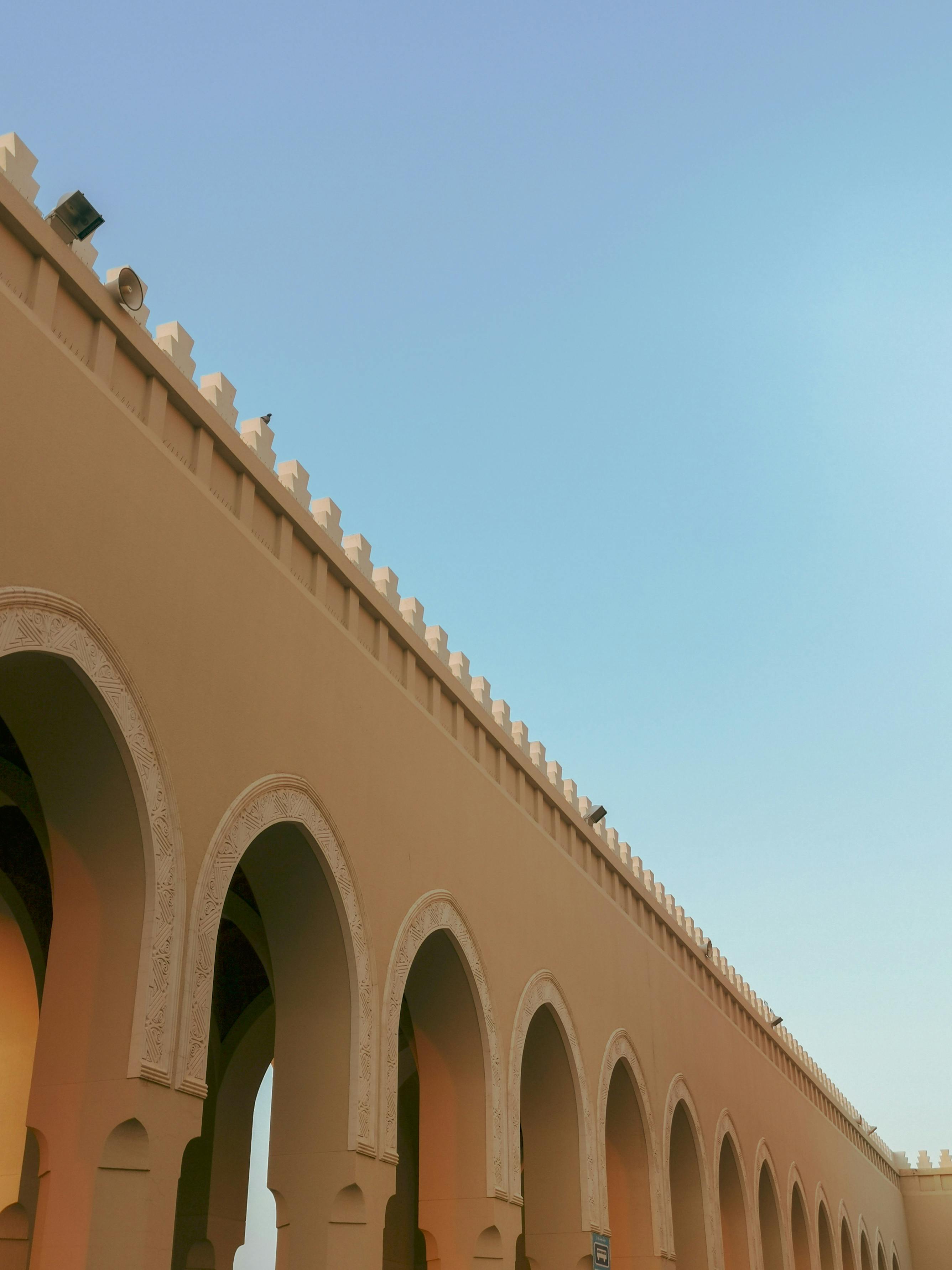 Part of a Building with Battlements and Arches · Free Stock Photo