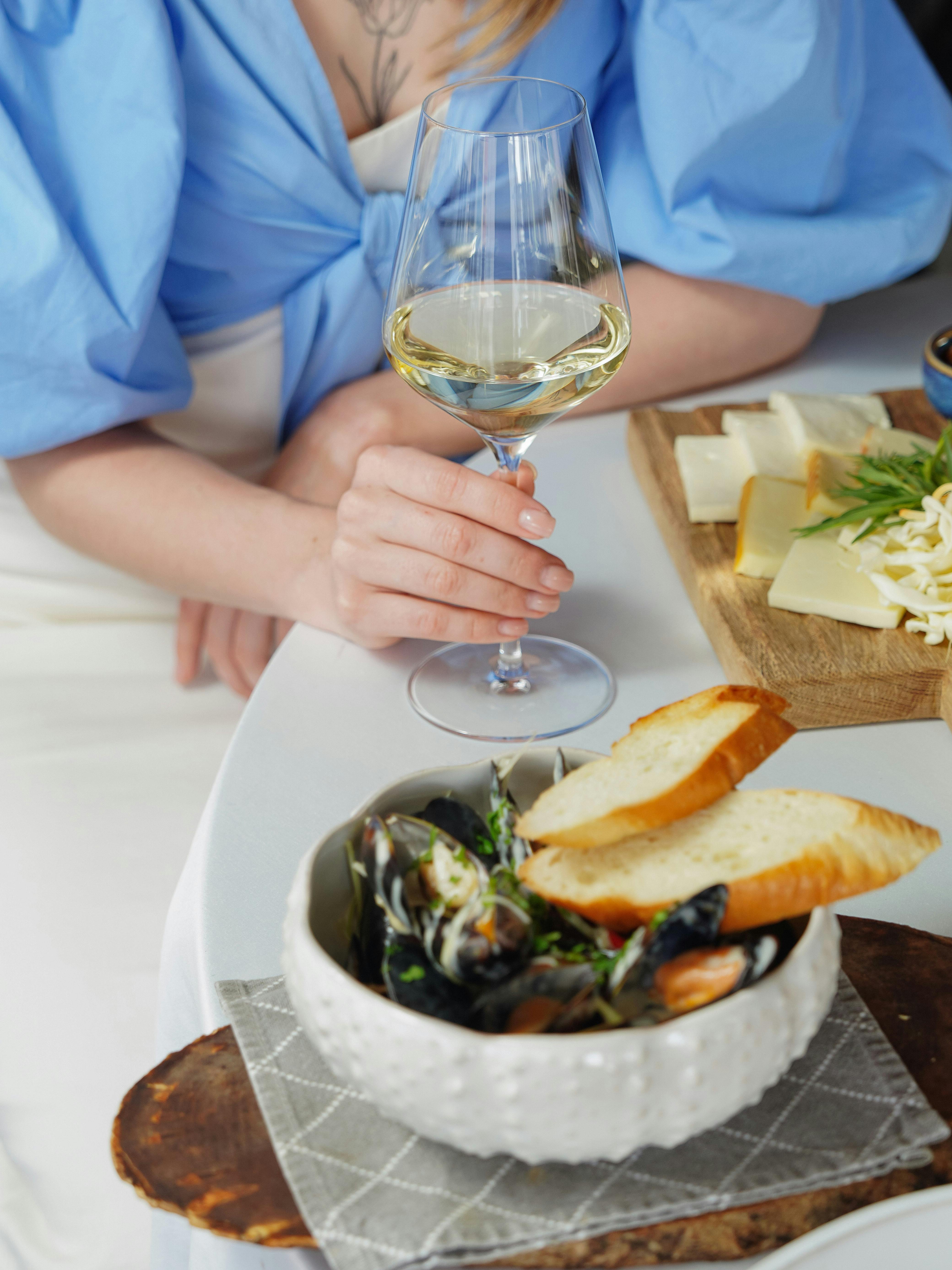 Woman Hand on Glass on Table · Free Stock Photo