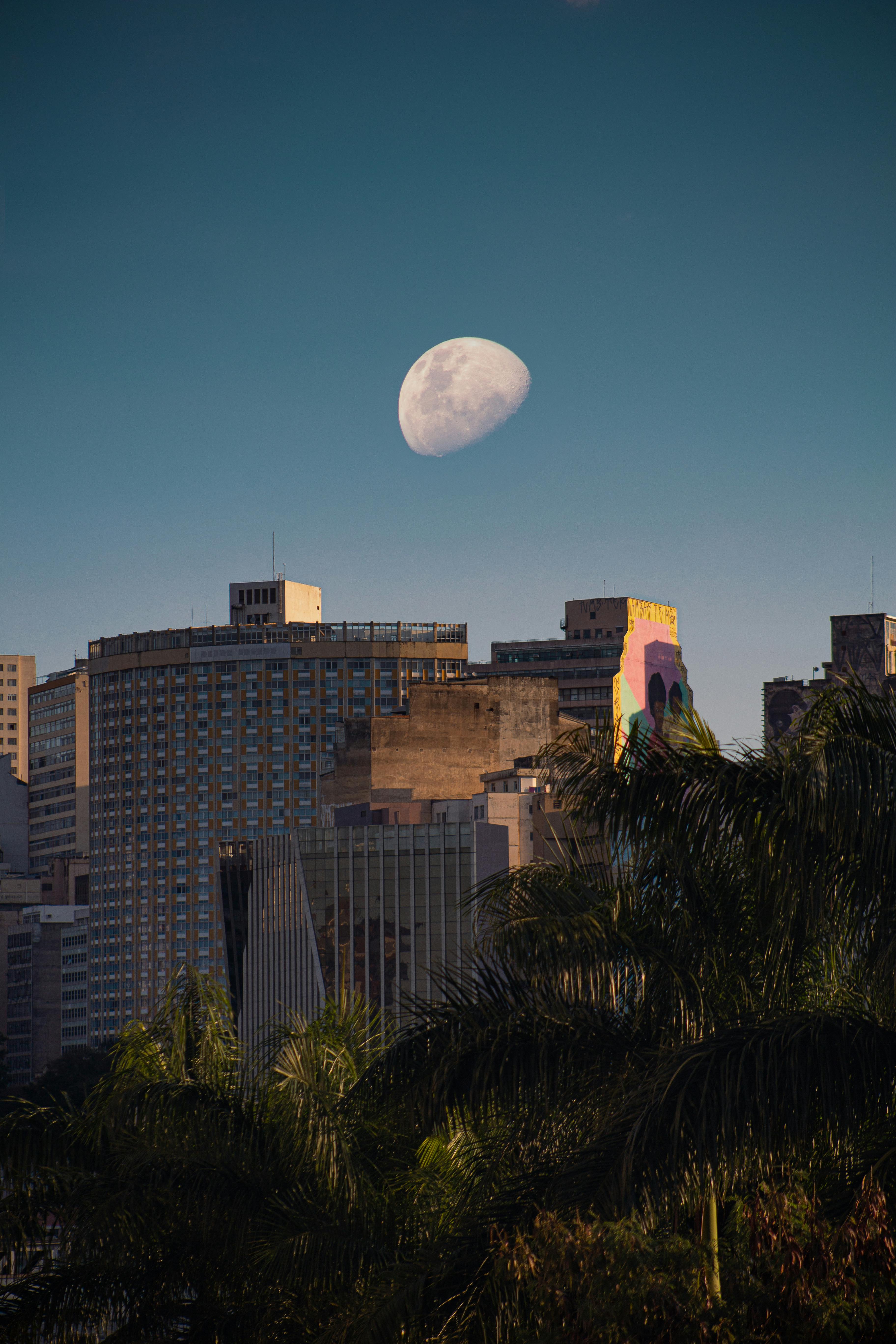 Moon over Buildings in City · Free Stock Photo