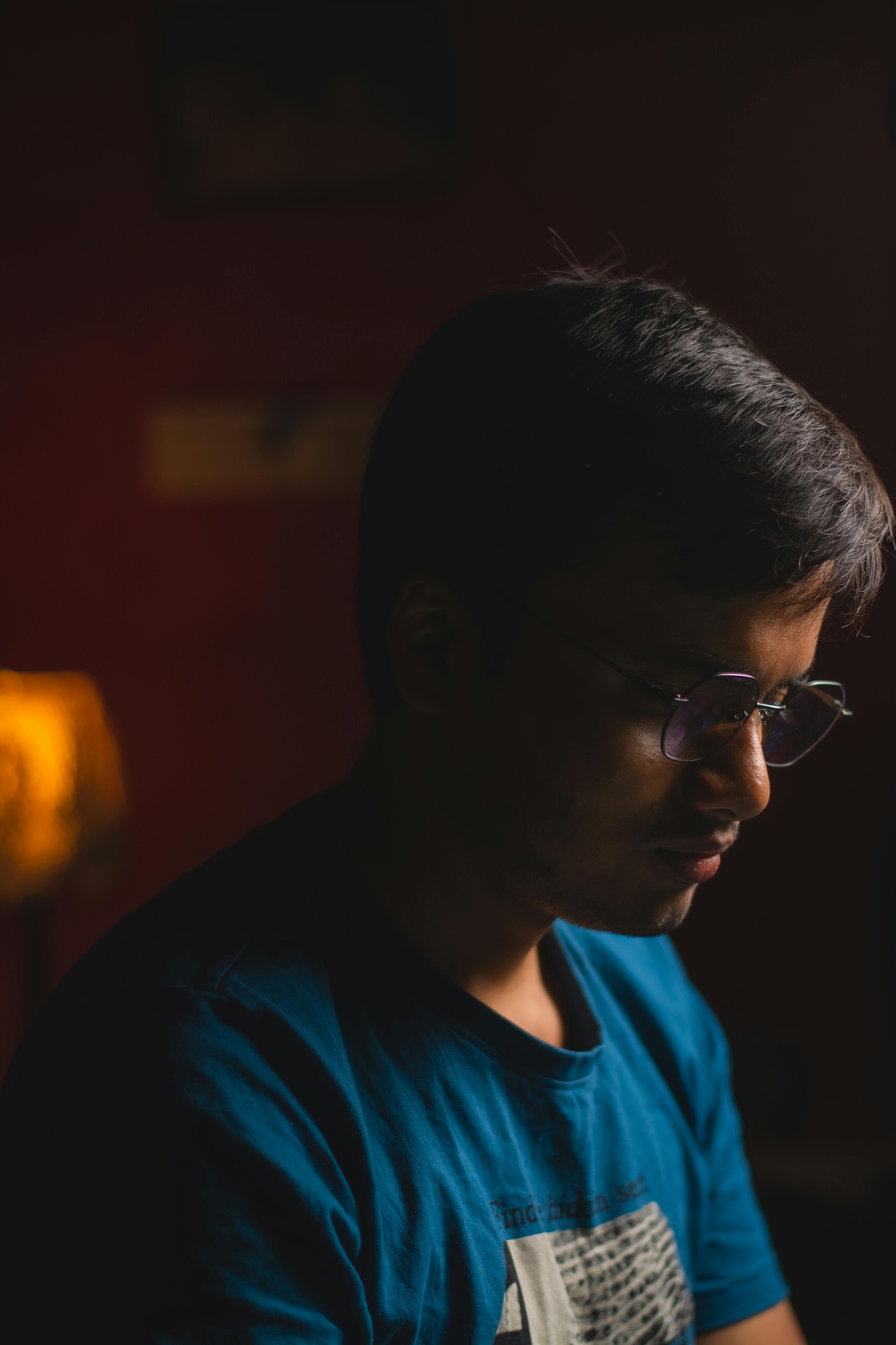 Portrait of a Woman in Dim Light · Free Stock Photo