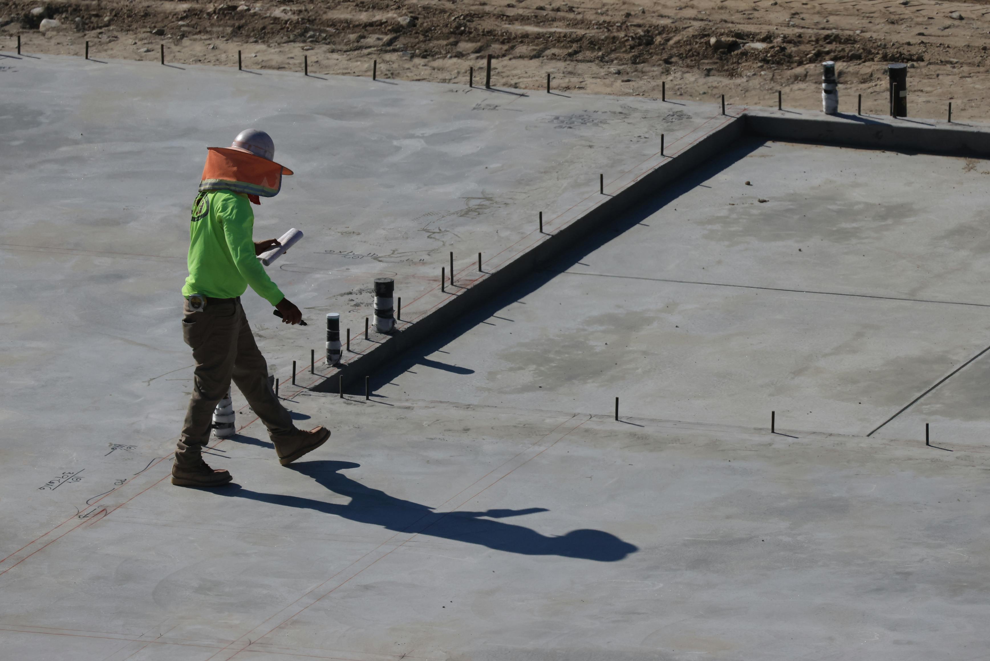 A Man and Woman Having Conversation at the Construction Site · Free ...
