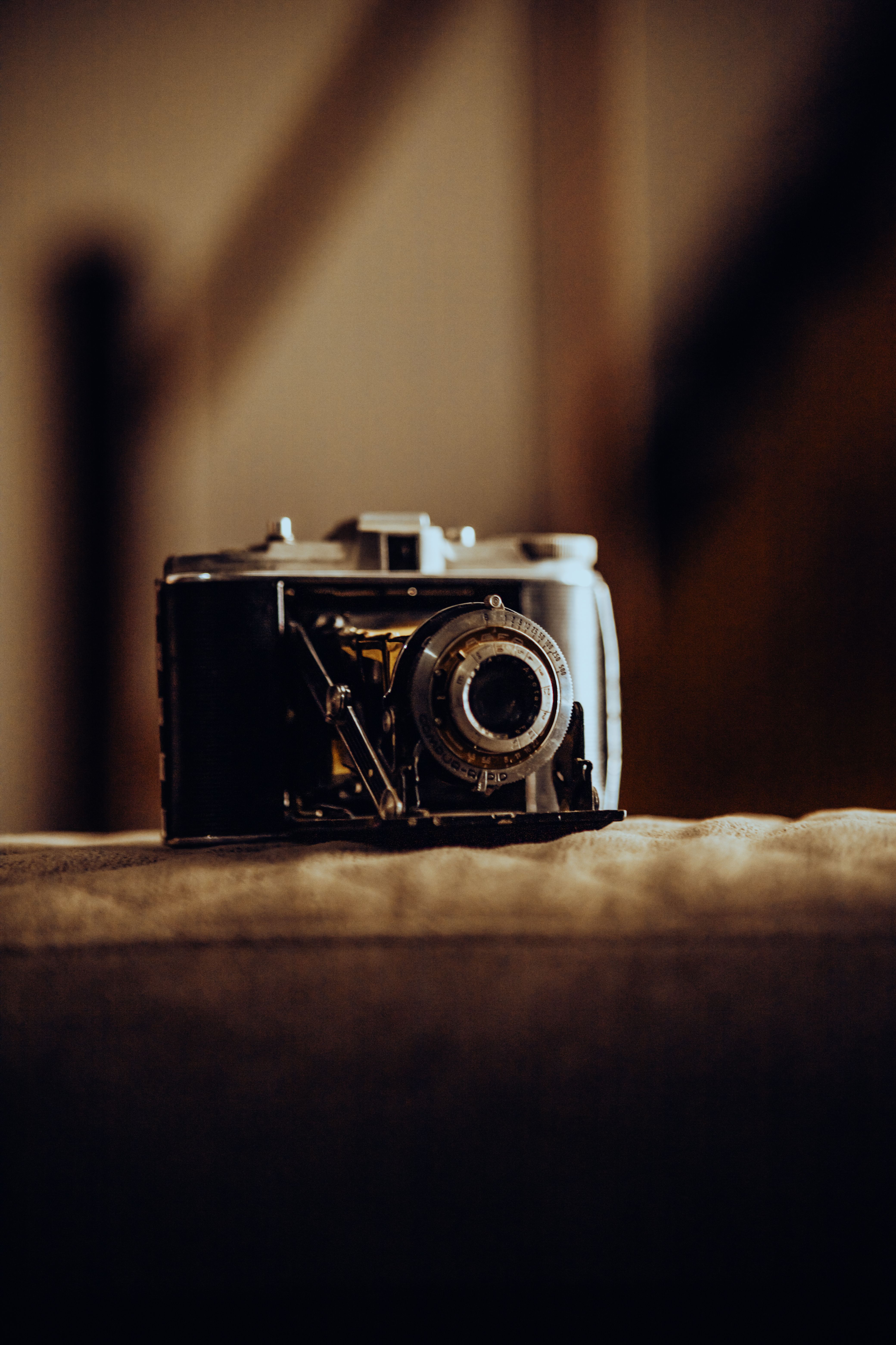Silver and Black Shallow Focus Camera on Table · Free Stock Photo