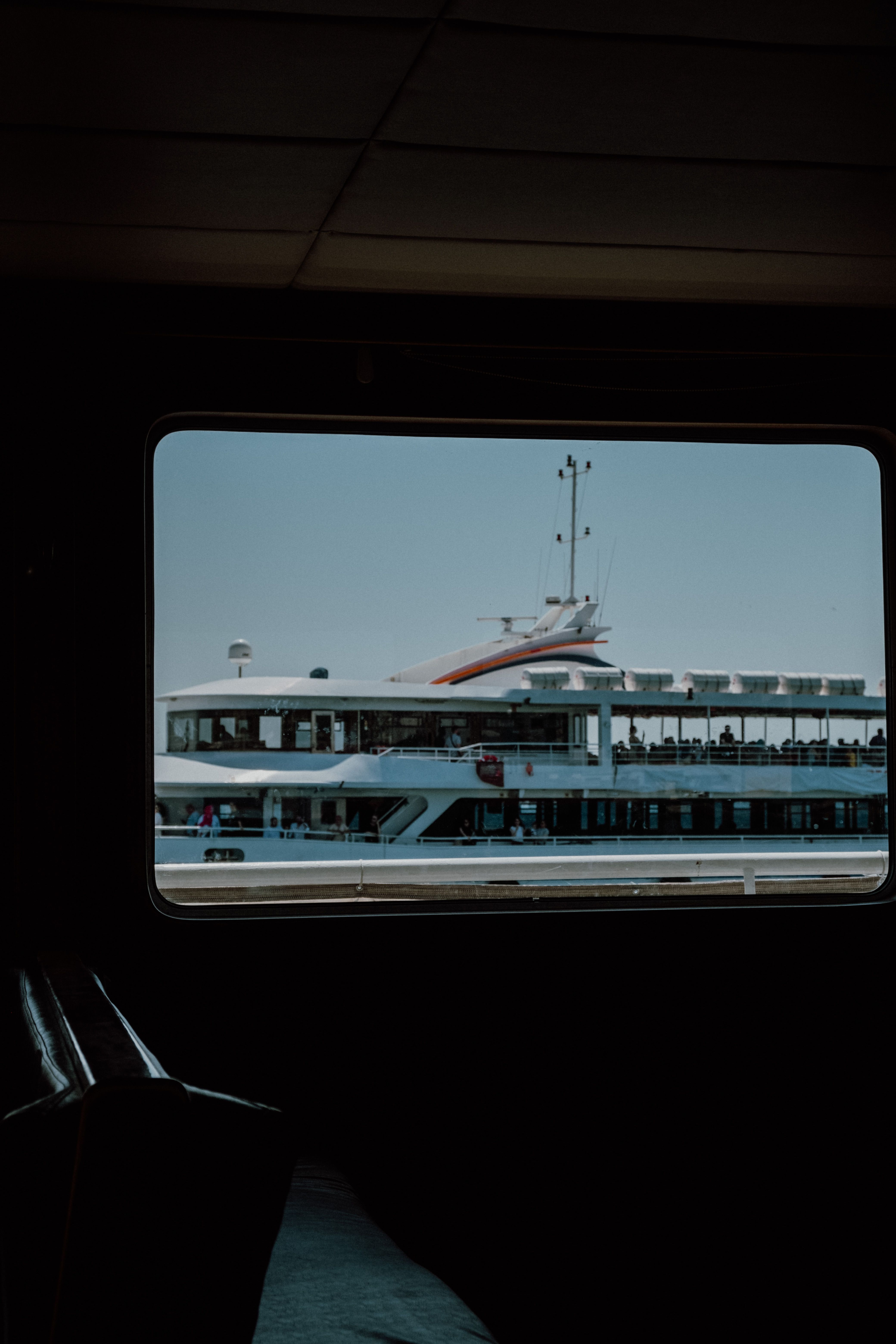 White Motorboat and Ship behind · Free Stock Photo