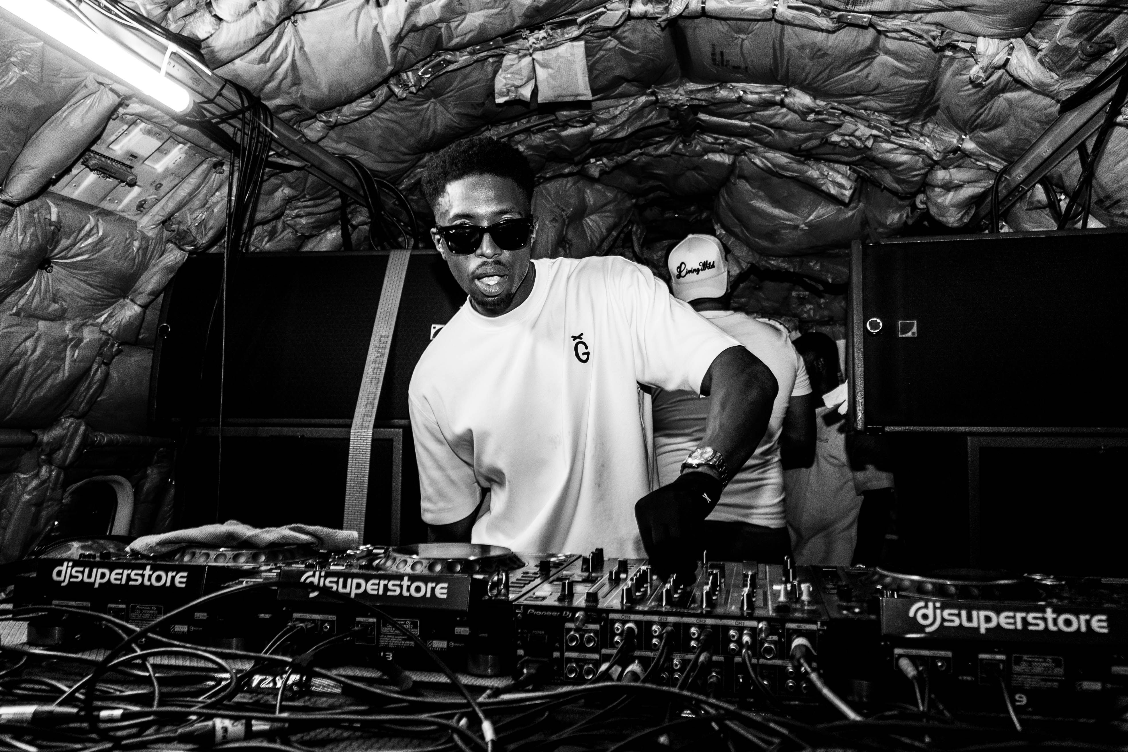 DJ with Mixer in Black and White · Free Stock Photo