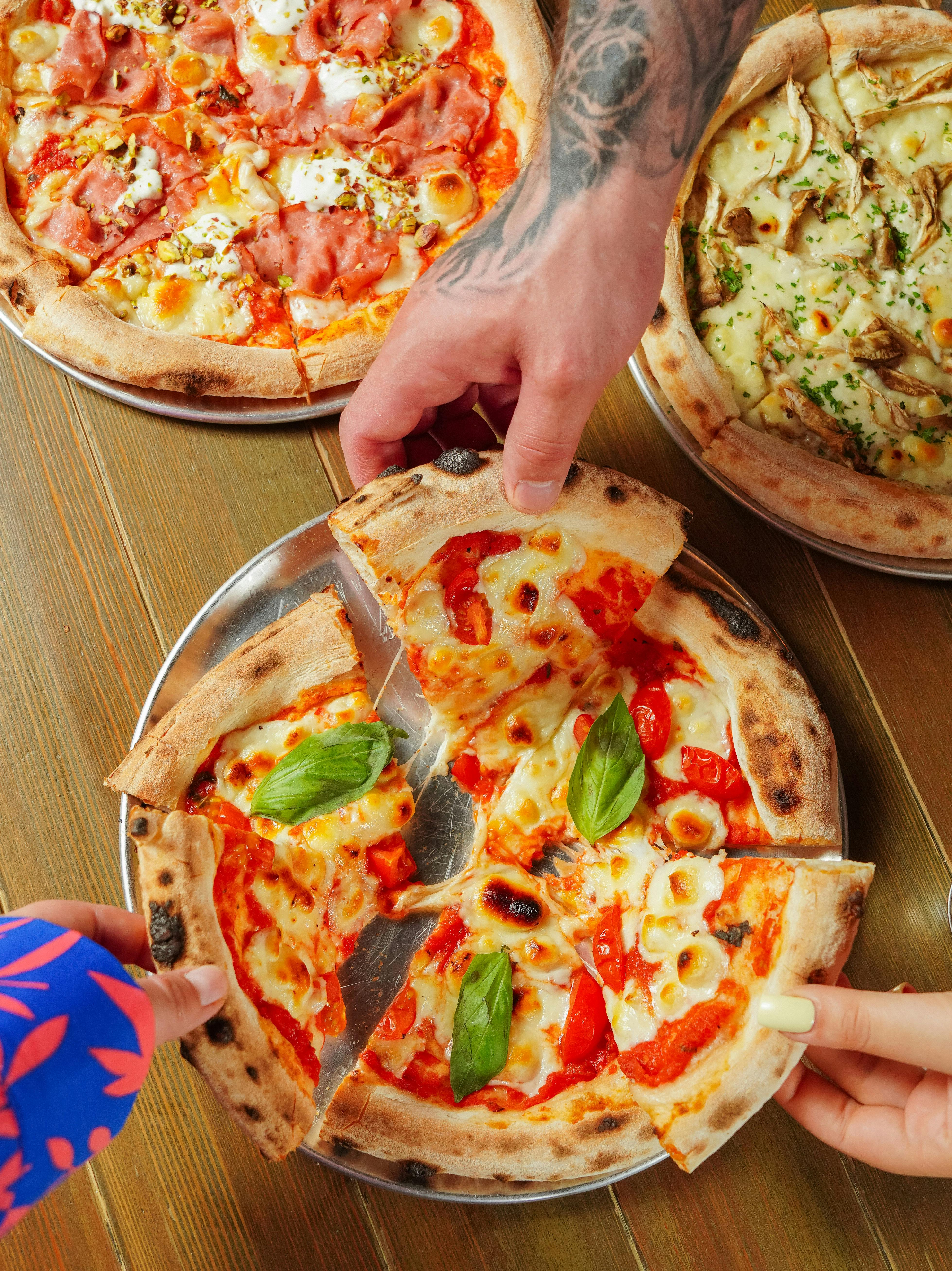 Three Pizza on Table · Free Stock Photo