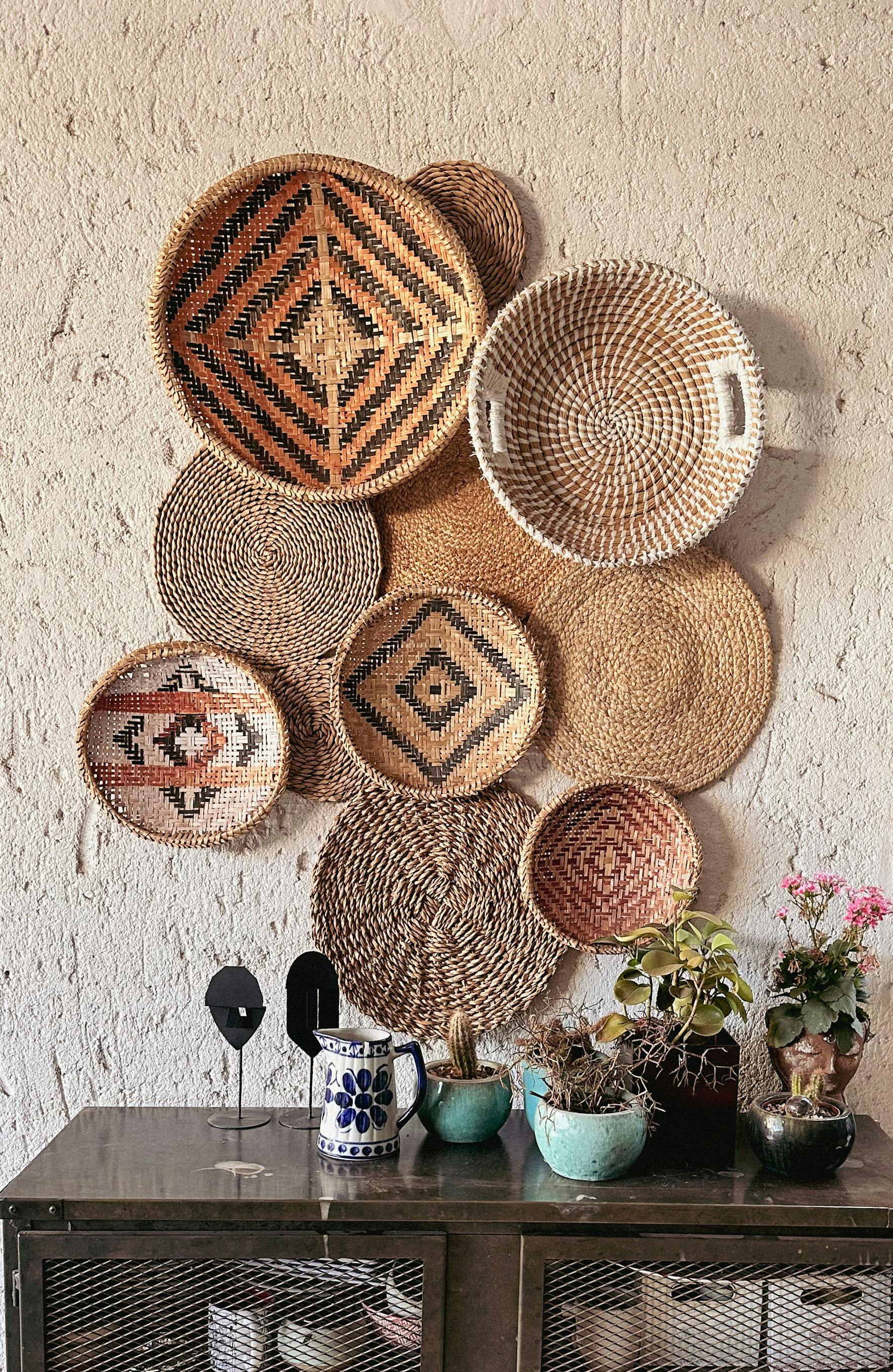Wicker Plates on Wall over Dresser · Free Stock Photo