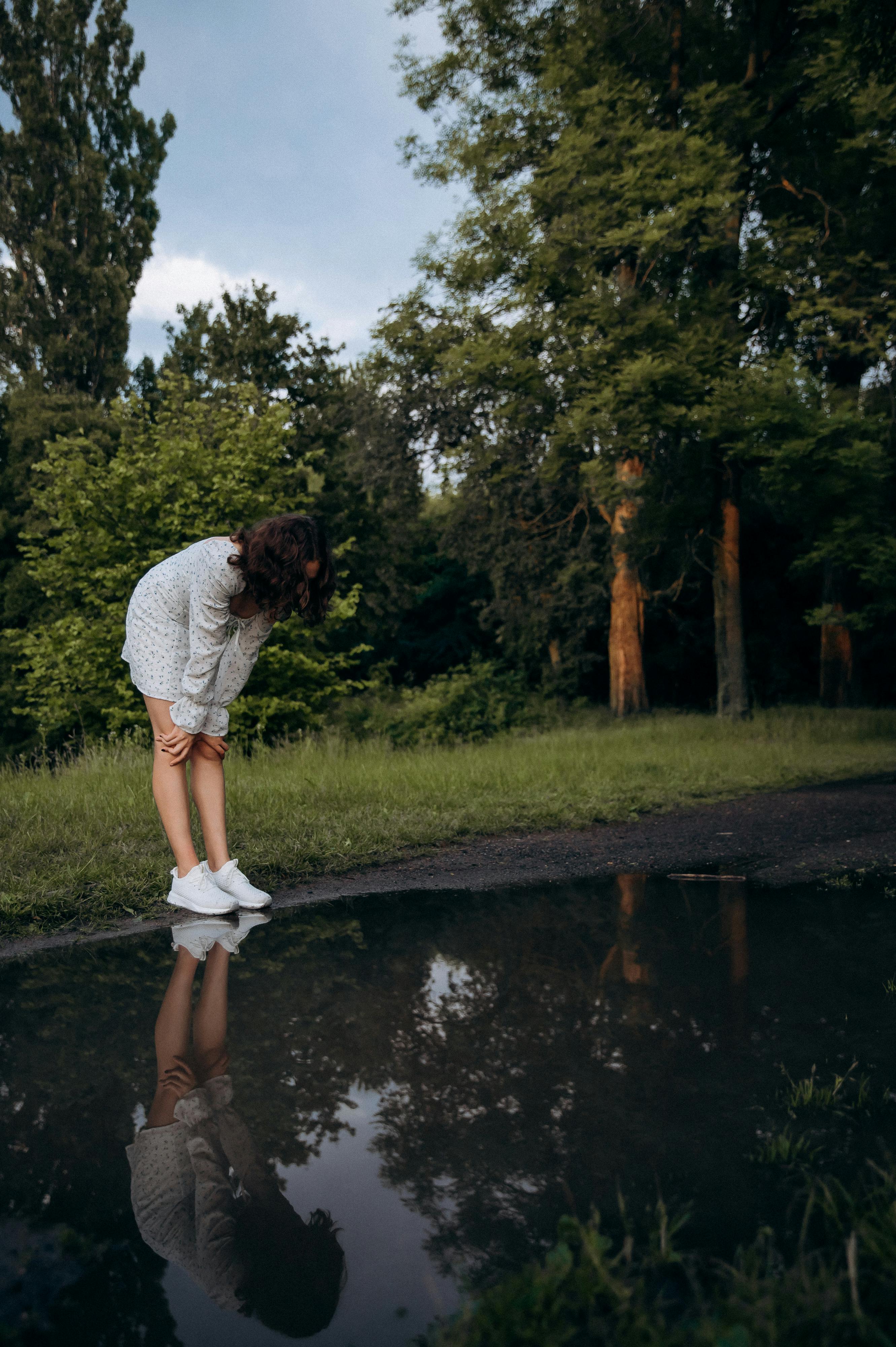 Girl Reflecting in a Puddle · Free Stock Photo