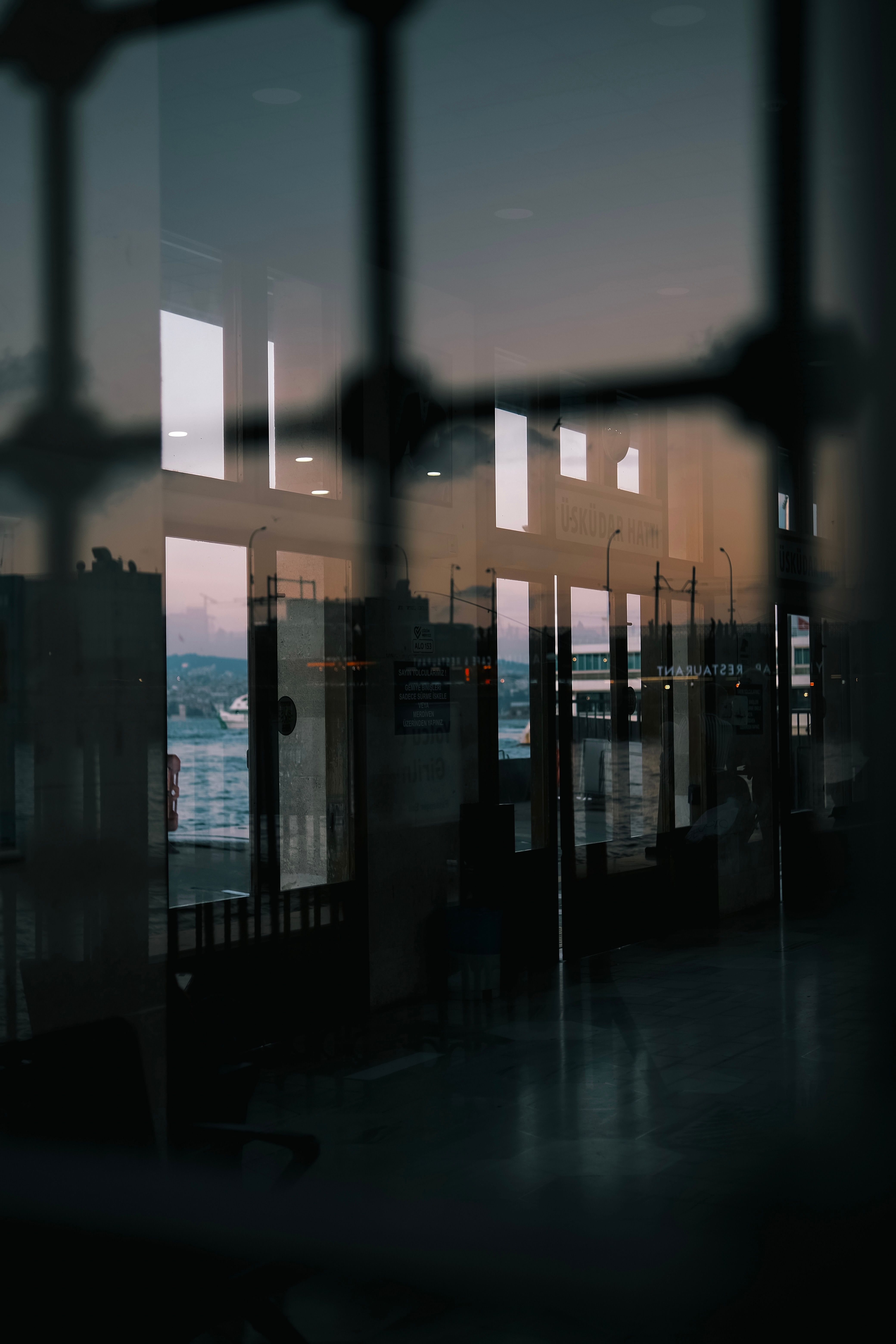Harbor Seen through Empty Port Terminal Building Windows · Free Stock Photo