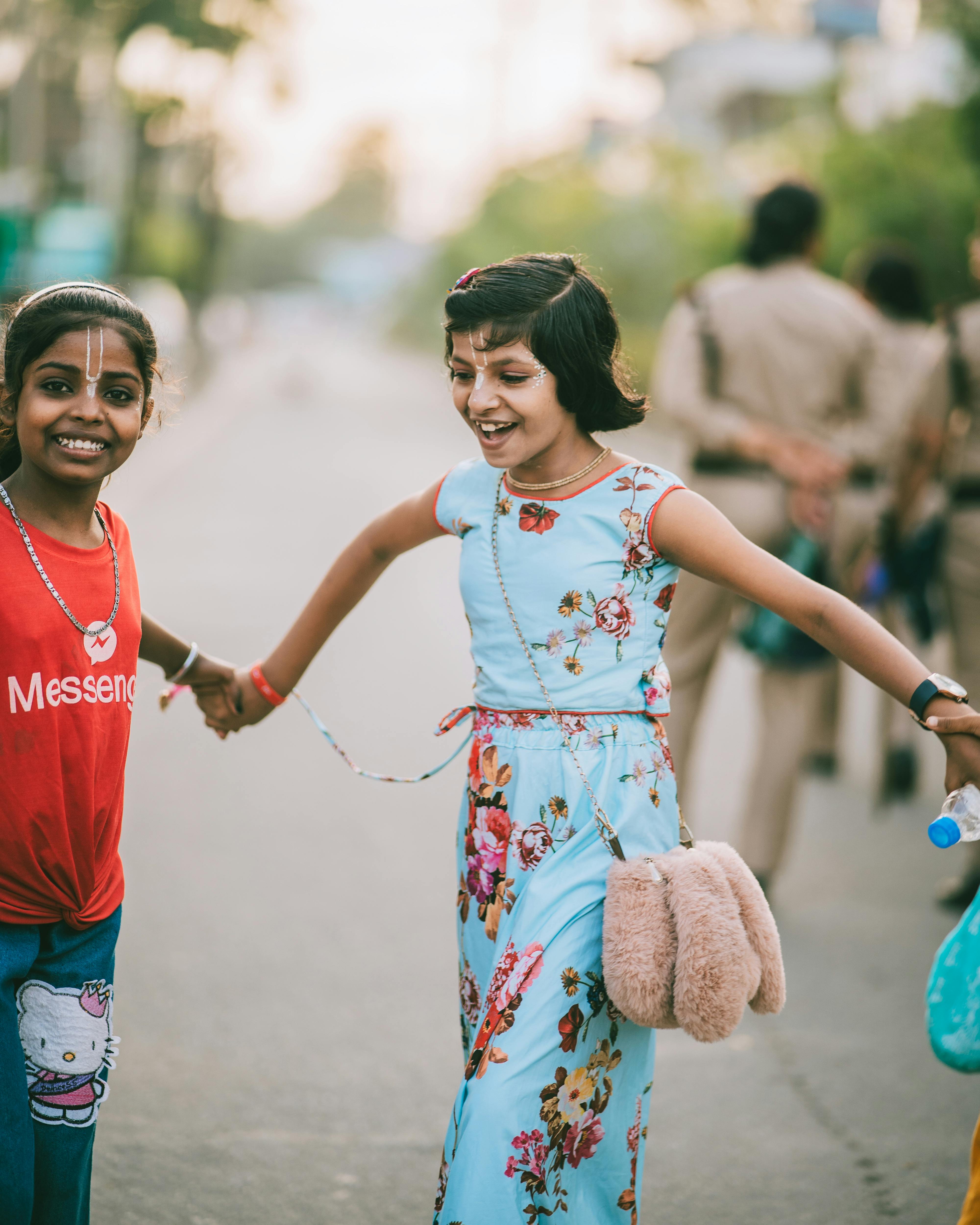 Children Jumping While Holding Hands · Free Stock Photo