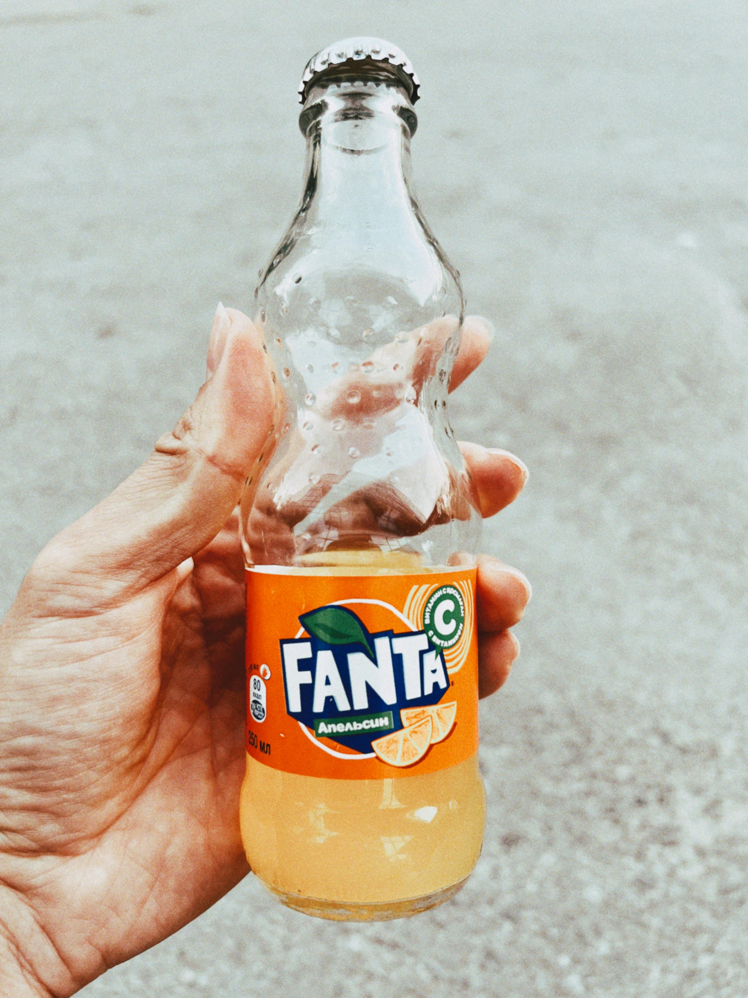 Hand Holding Fanta Bottle · Free Stock Photo