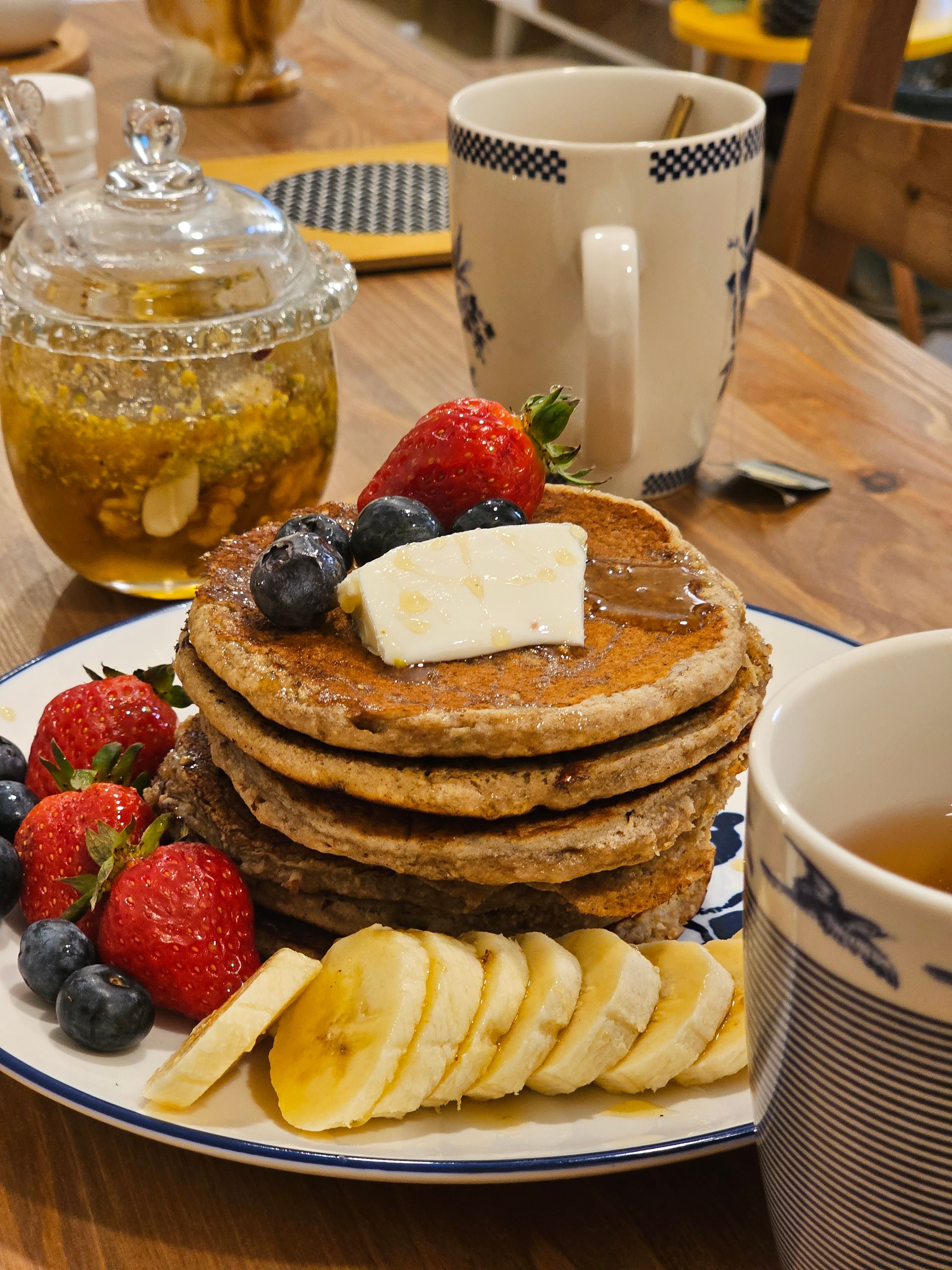 Pancakes with Fruits and Tea on a Table · Free Stock Photo