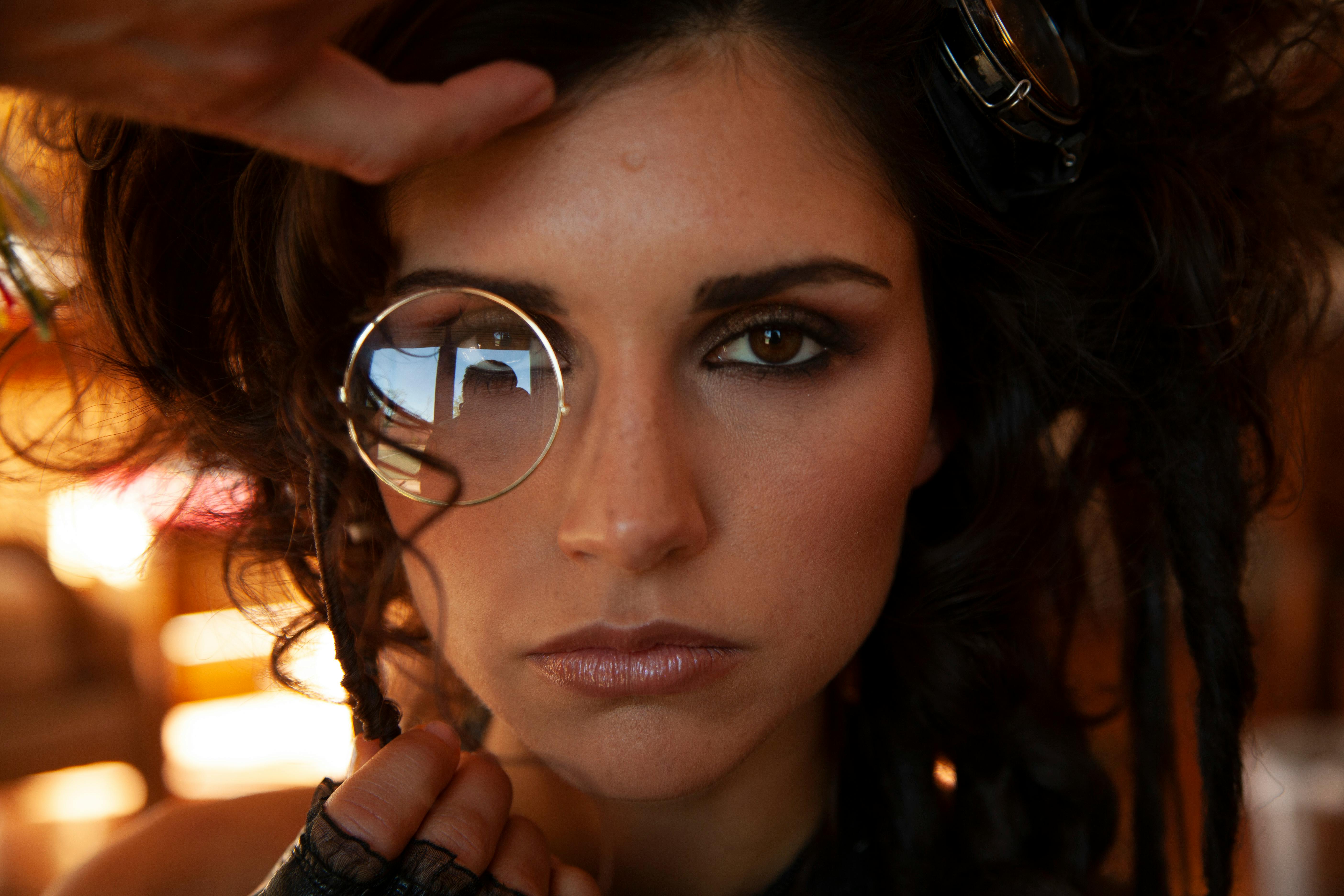 Young Woman with a Monocle · Free Stock Photo