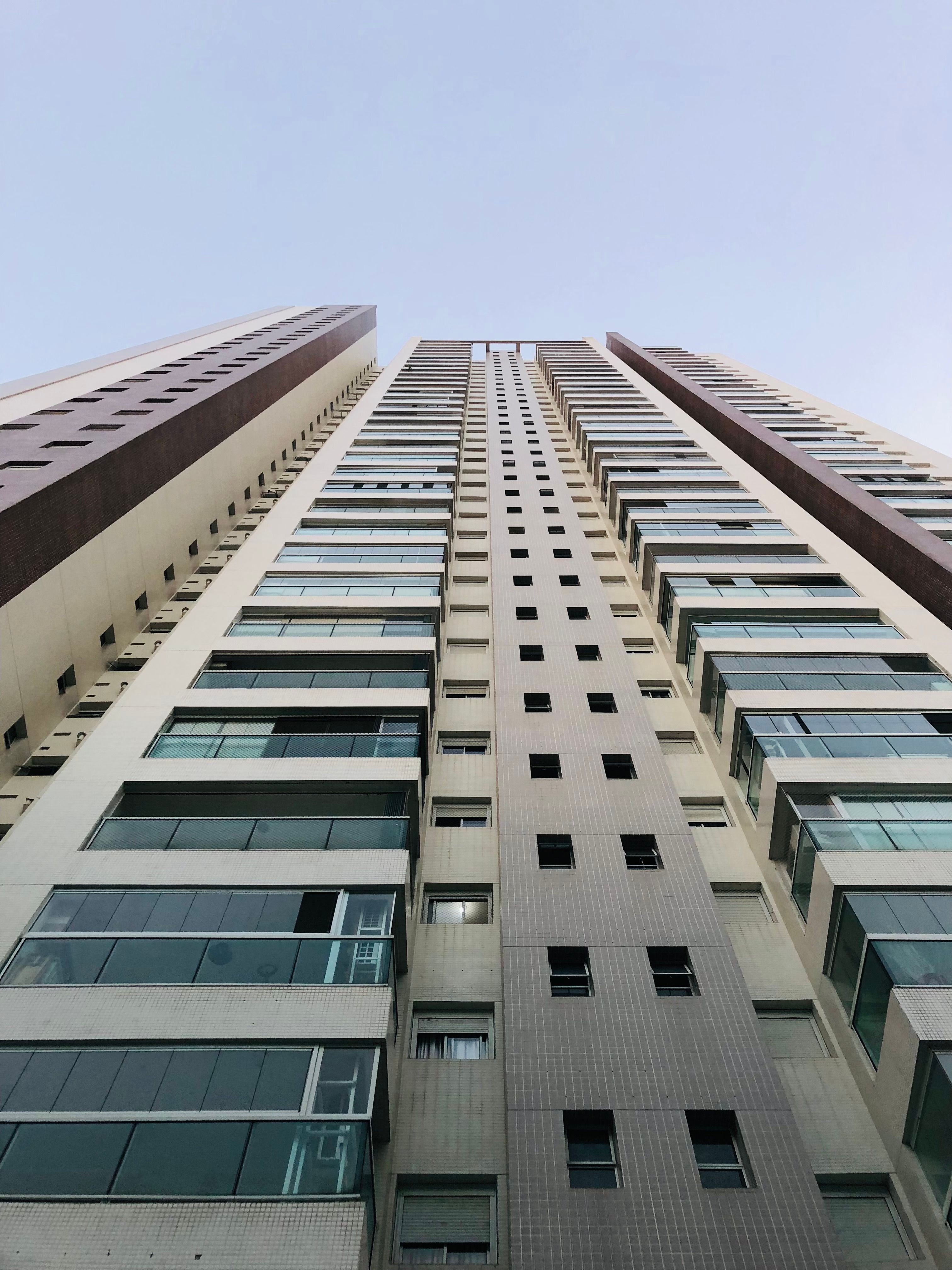 Low Angle Shot of a Modern Apartment Skyscraper · Free Stock Photo