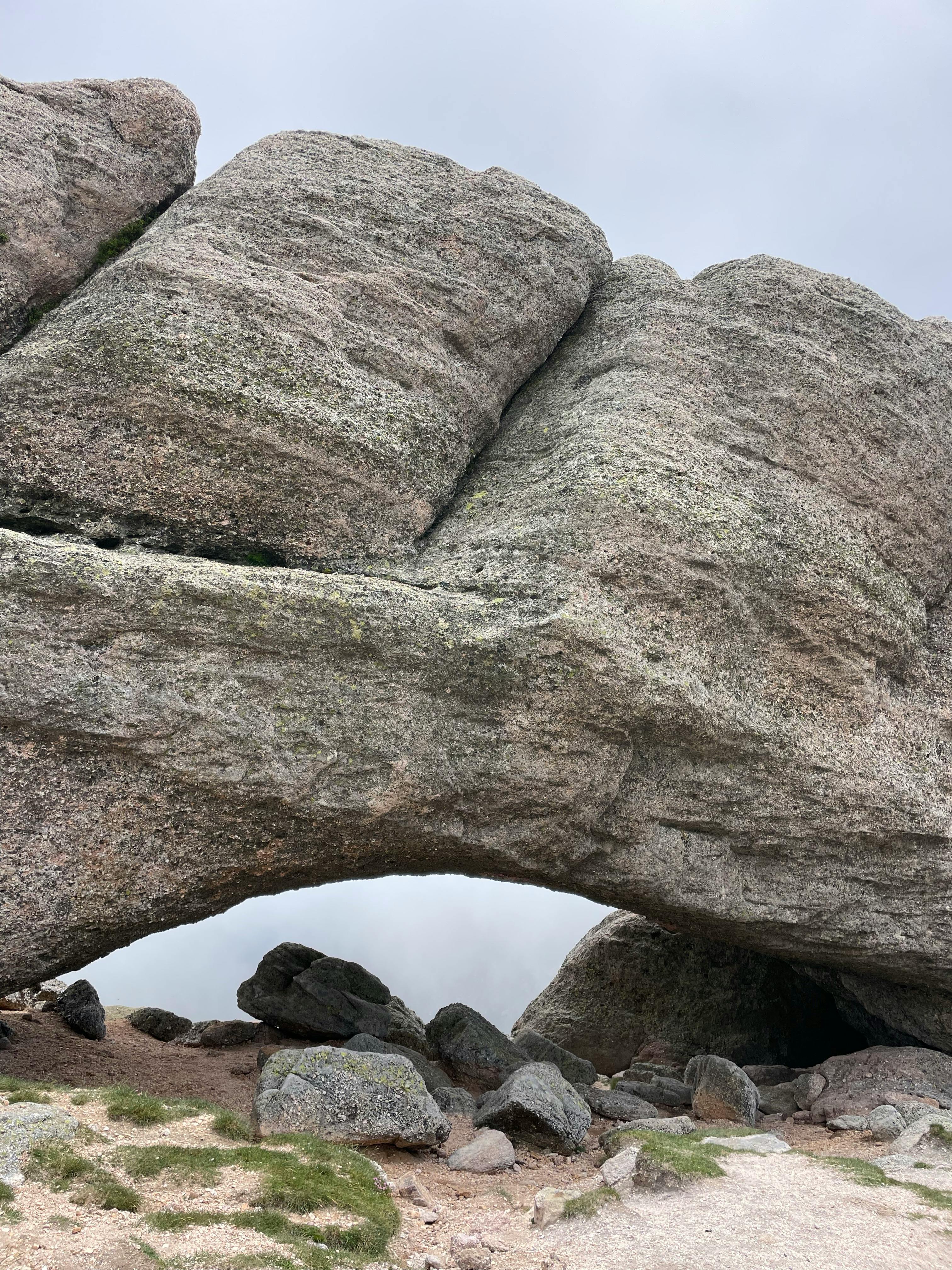 A Large Rock Formation with an Arch · Free Stock Photo