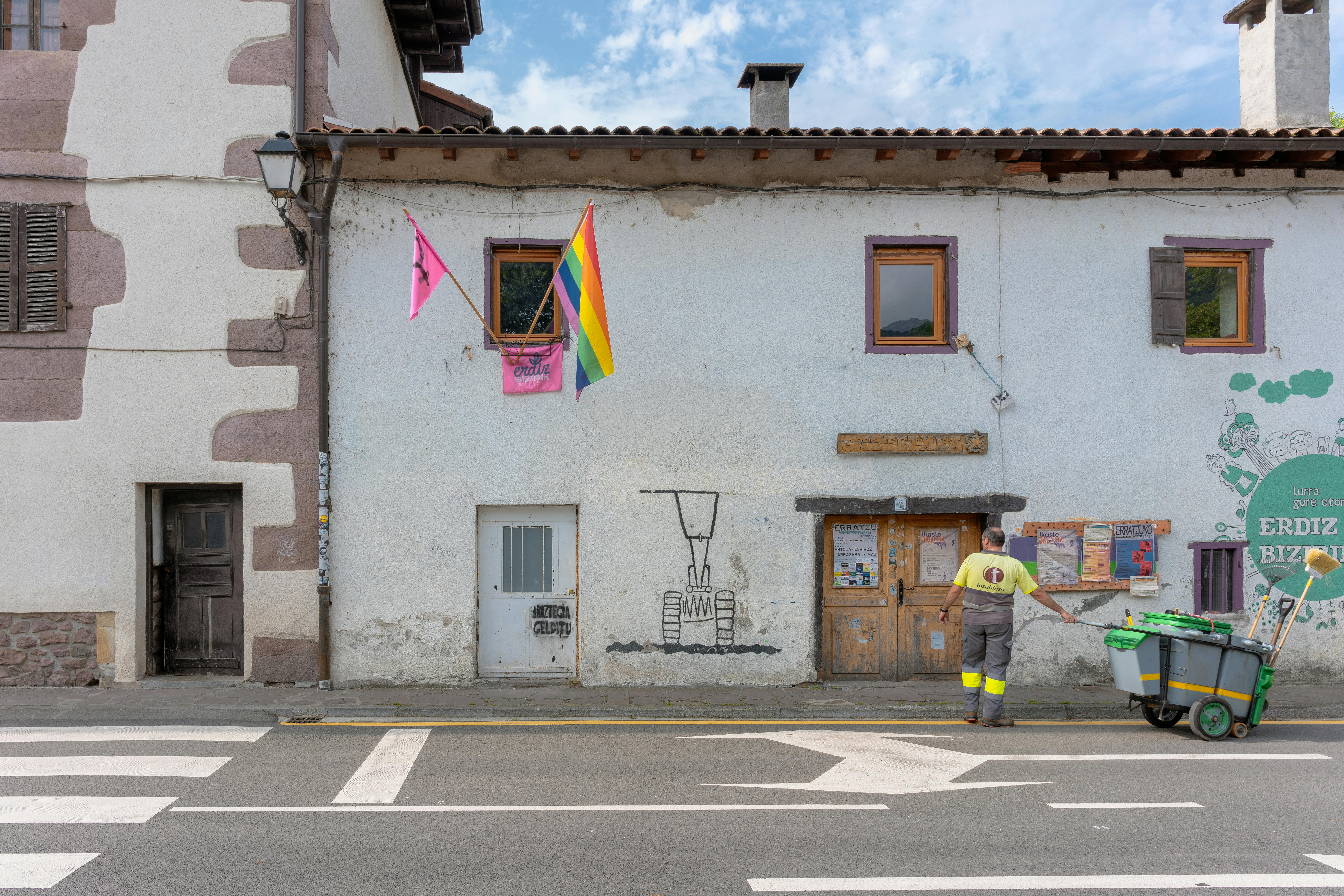Cleaner Standing near Building Wall · Free Stock Photo