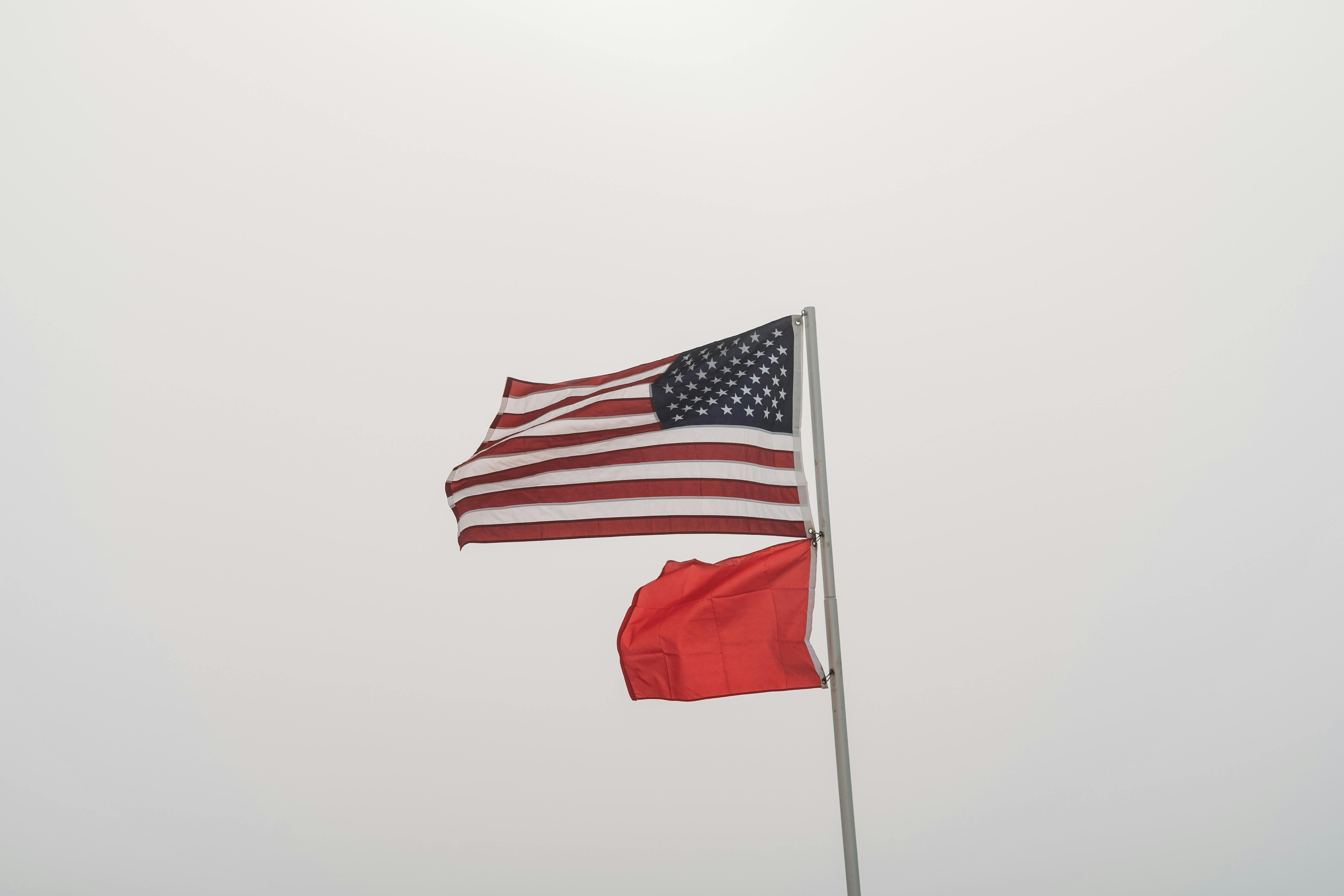 Red Flag and Flag of USA · Free Stock Photo