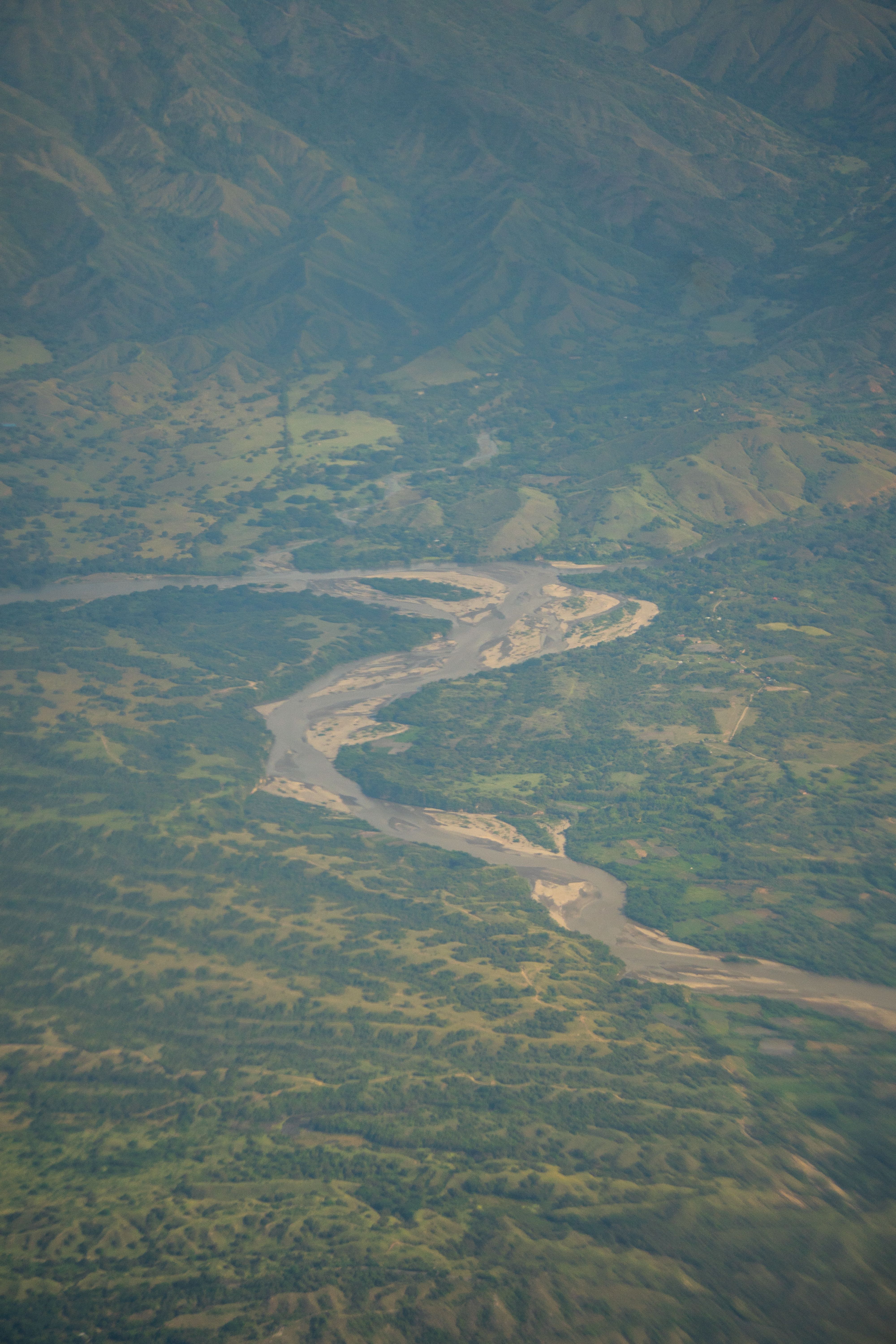 Aerial View of a Valley with a River · Free Stock Photo