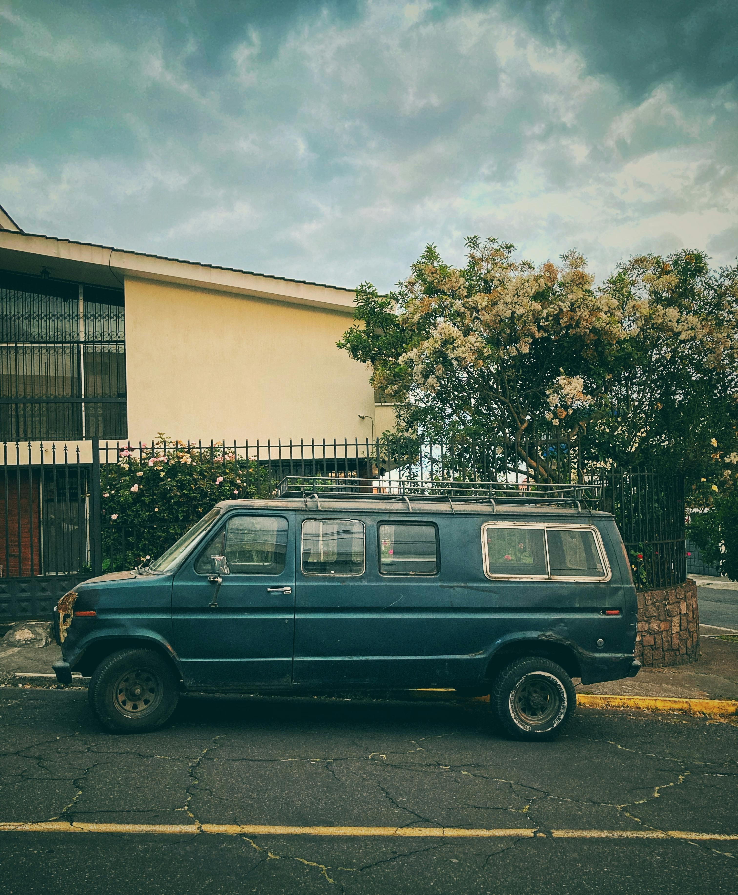 A Car Parked in Front of a House · Free Stock Photo
